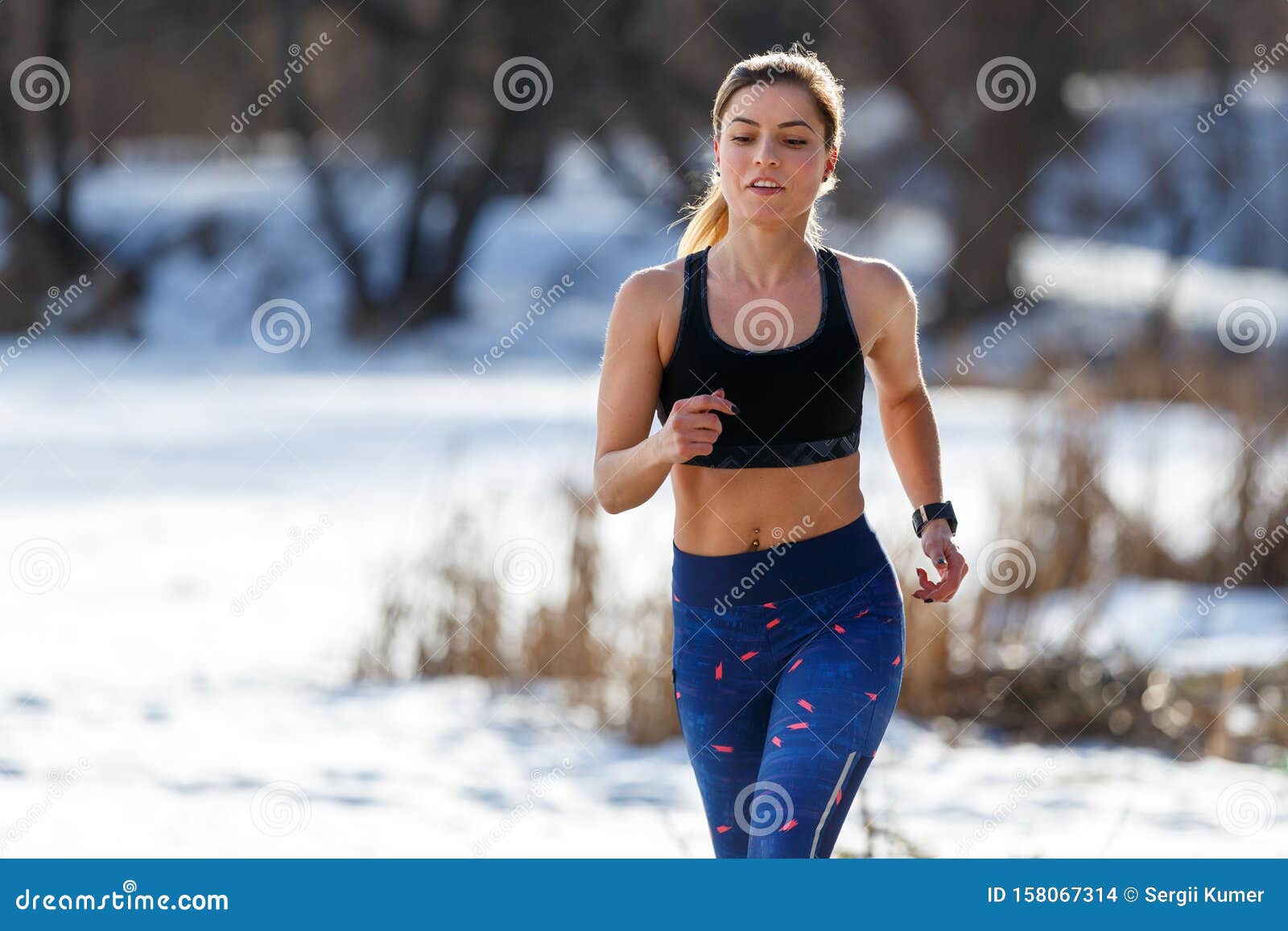 Young Woman in Top Running in Cold Weather Stock Photo - Image of ...