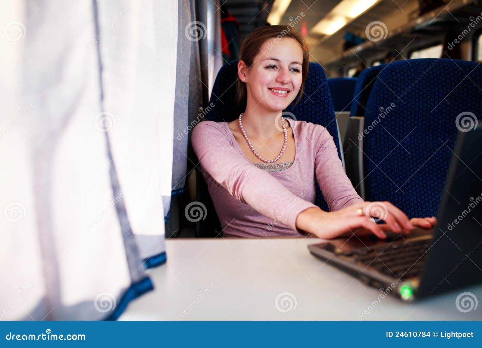 Young woman on the train stock photo. Image of laptop - 24610784