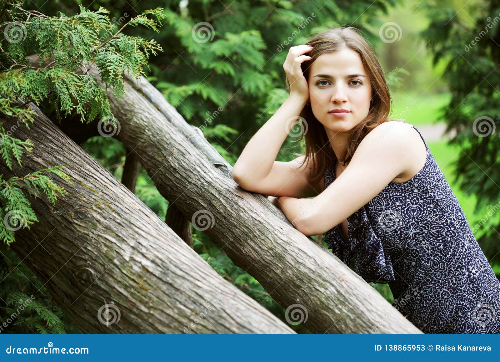 Young woman on a tree stock image. Image of emotional - 138865953