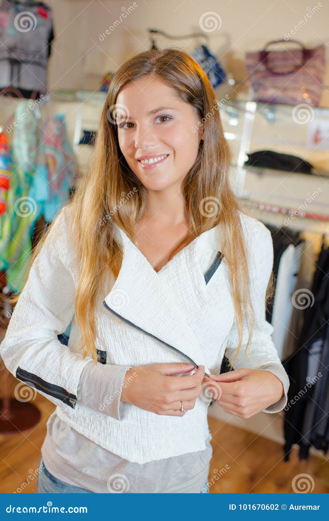 Young Woman Trying on Jacket Stock Photo - Image of portrait, button ...