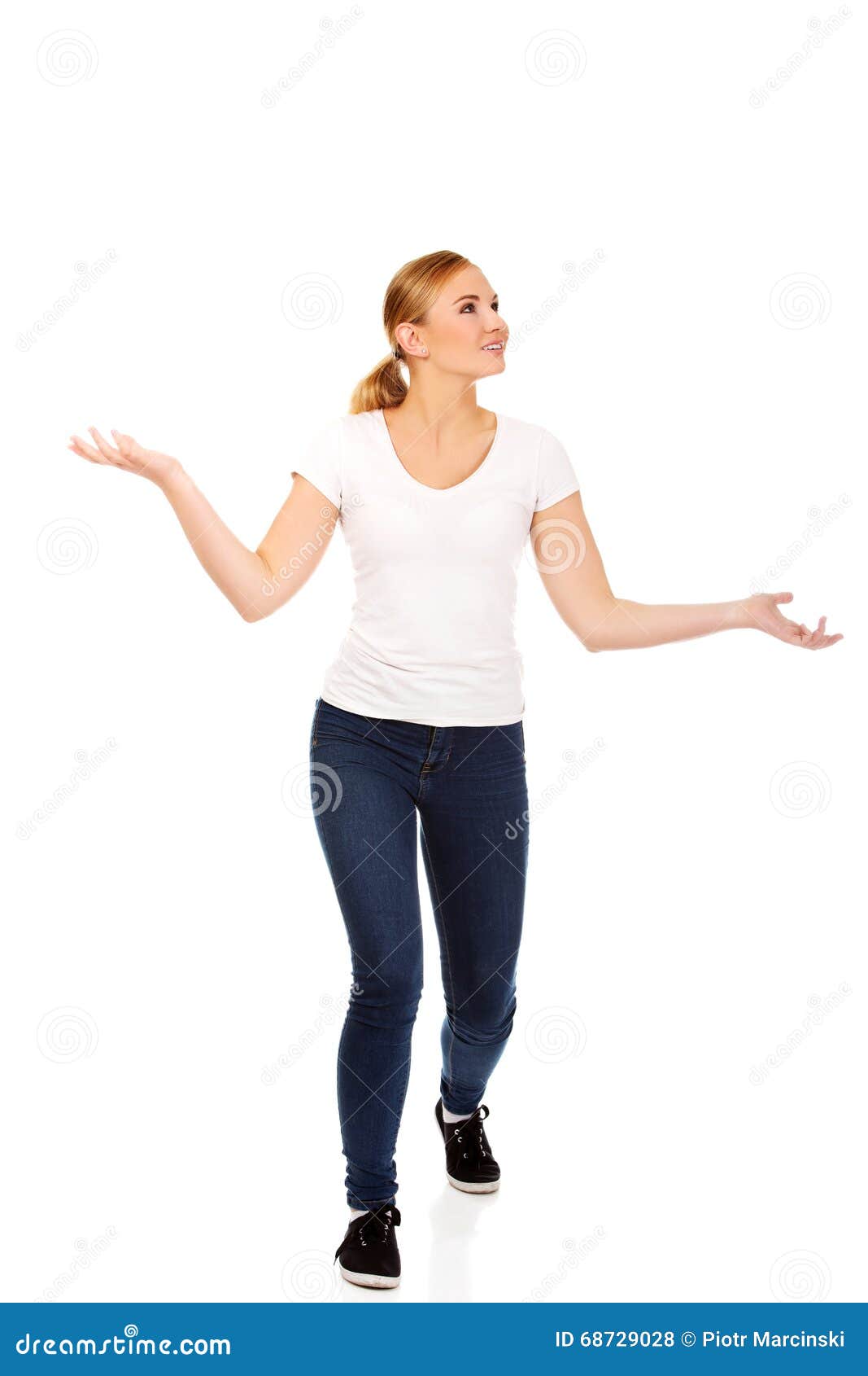 Young Woman Trying To Catch Something Falling from the Sky Stock Photo ...