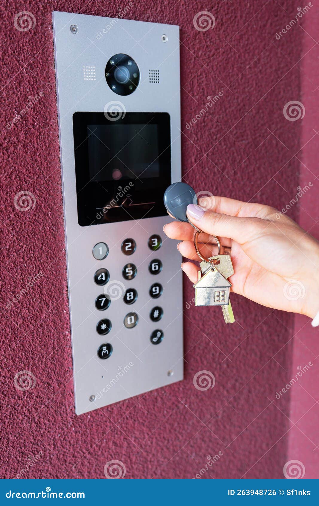 A Young Woman Types the Apartment Code on the Electronic Intercom Panel ...