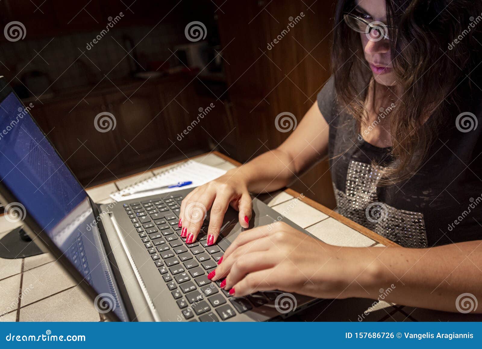 Young Woman Typing on Her Lap Top Stock Photo - Image of paper ...