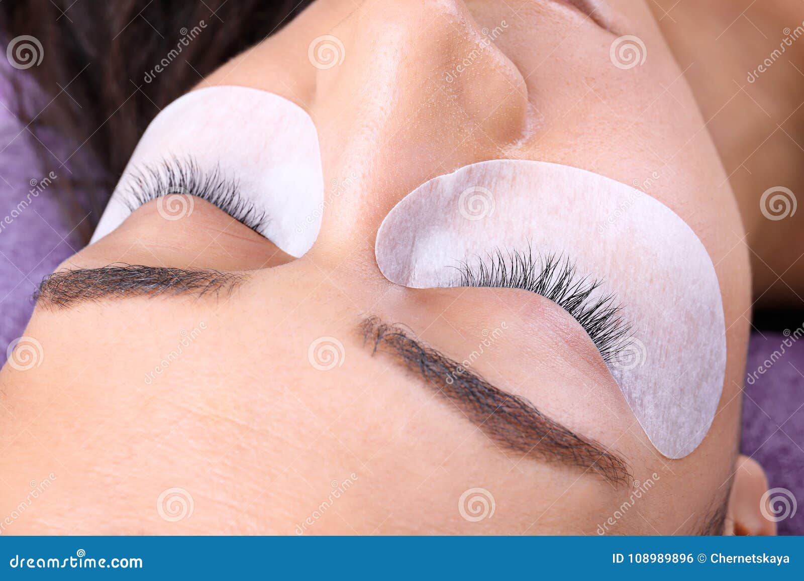 Young Woman Undergoing Eyelash Extensions Procedure, Stock Photo ...
