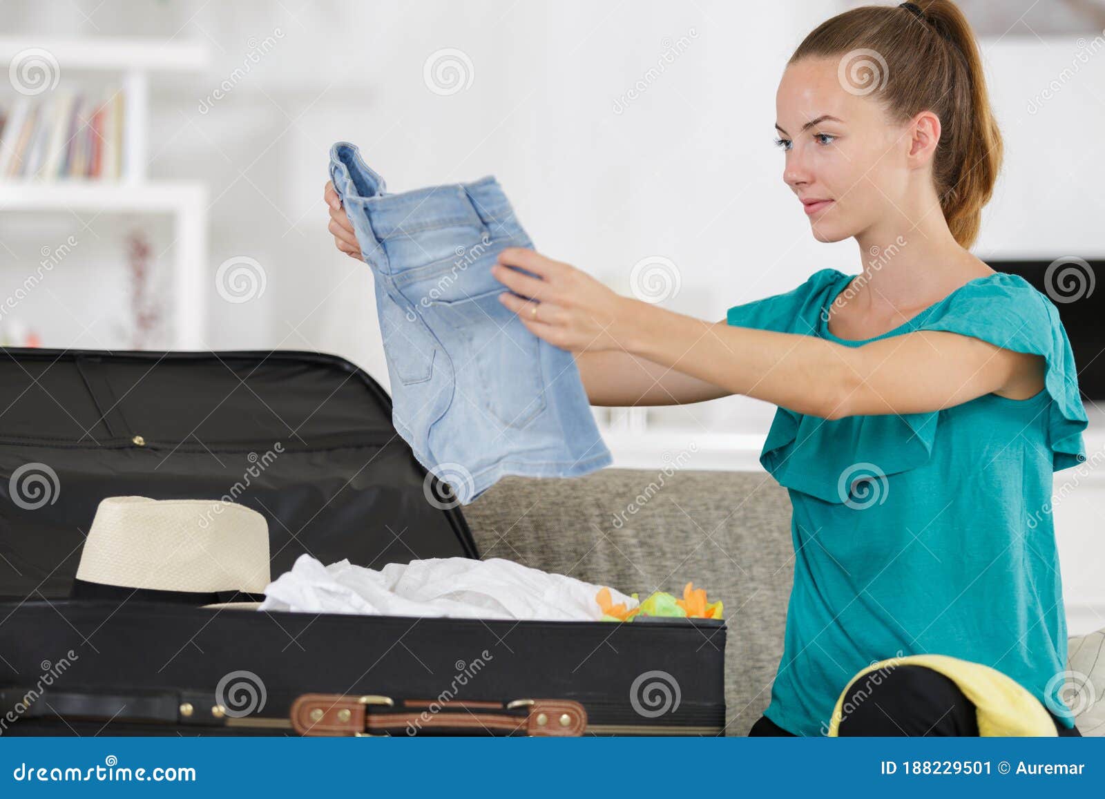 Young Woman Unpacking Suitcase Stock Image - Image of baggage ...