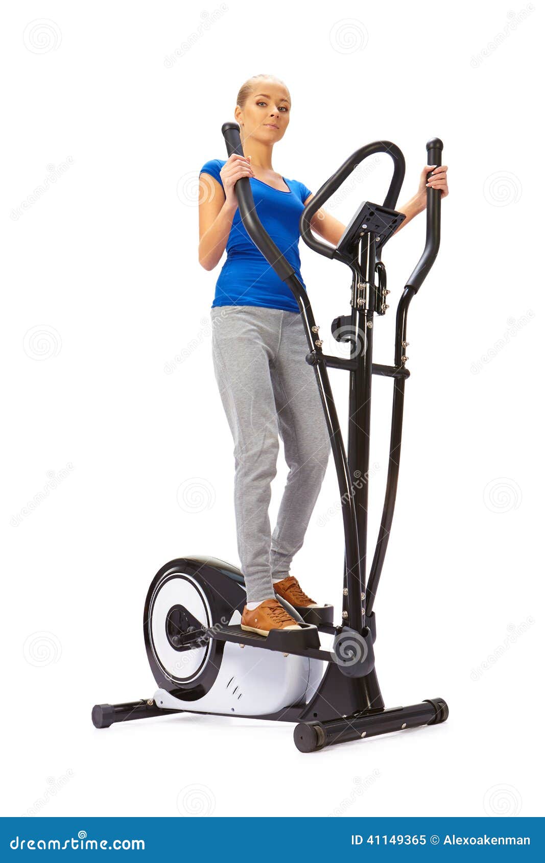 Young Woman Uses Elliptical Cross Trainer. Stock Image - Image of ...