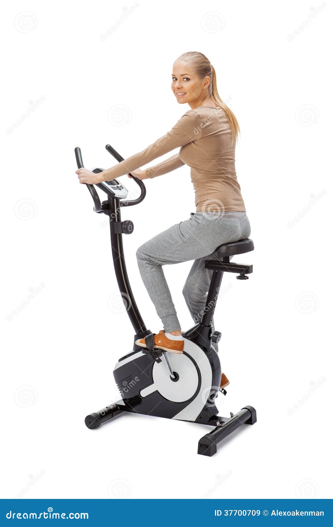 Young Woman Uses Stationary Bicycle Trainer. Stock Image - Image of ...