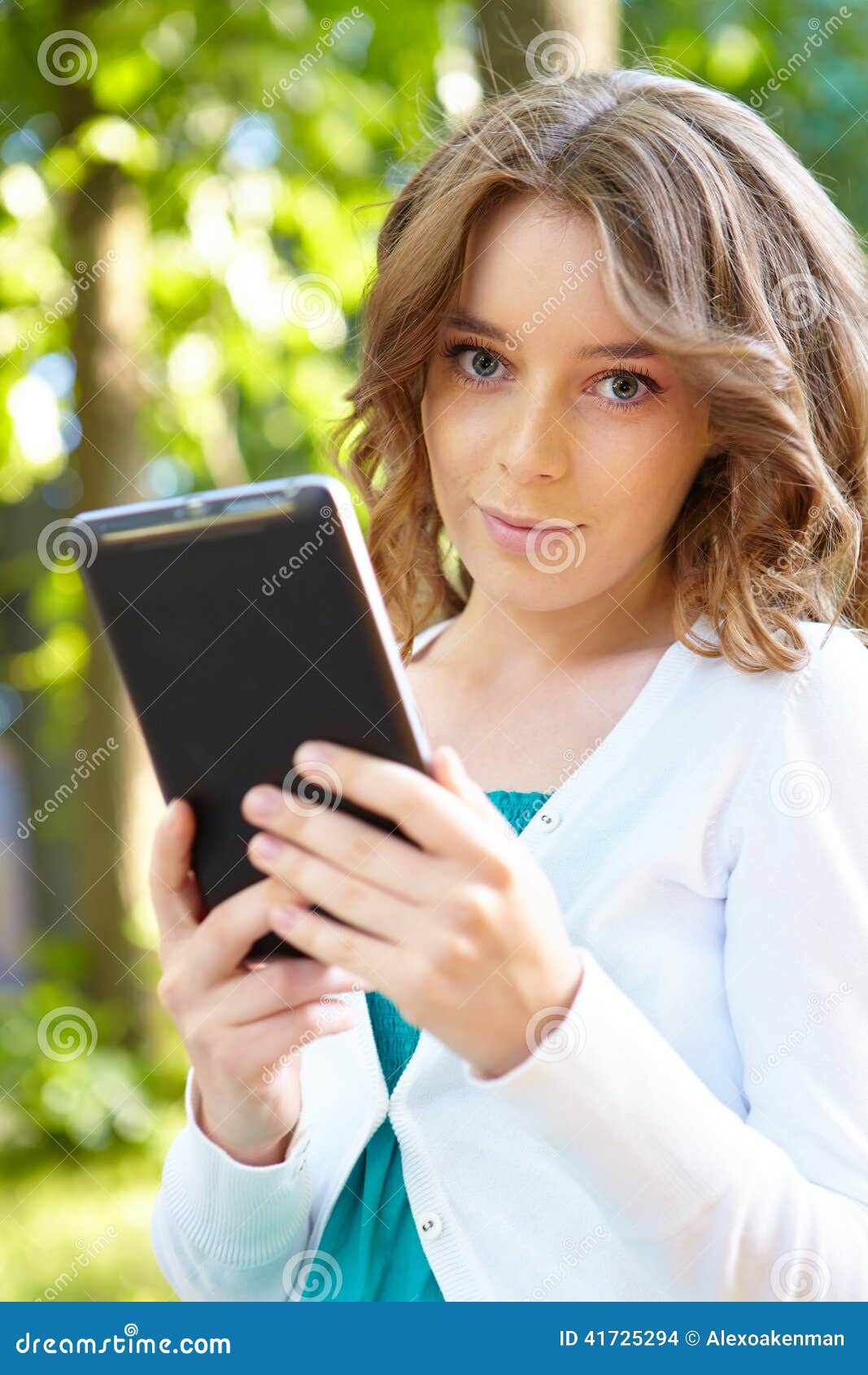 Young Woman Uses Tablet Pc. Stock Photo - Image of park, female: 41725294