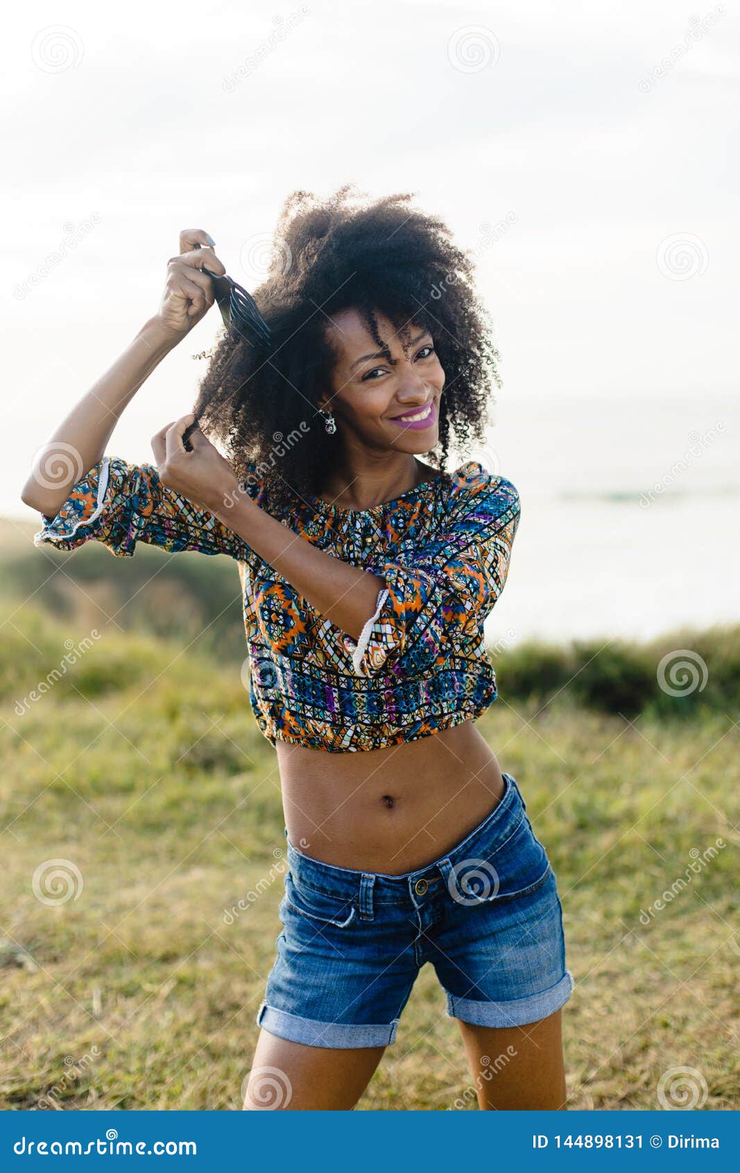 Young Woman Using Afro Hair Comb Stock Image - Image of comb, fashion ...