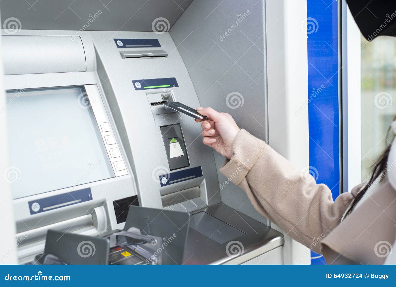 Young woman using ATM stock photo. Image of urban, attractive - 64932724
