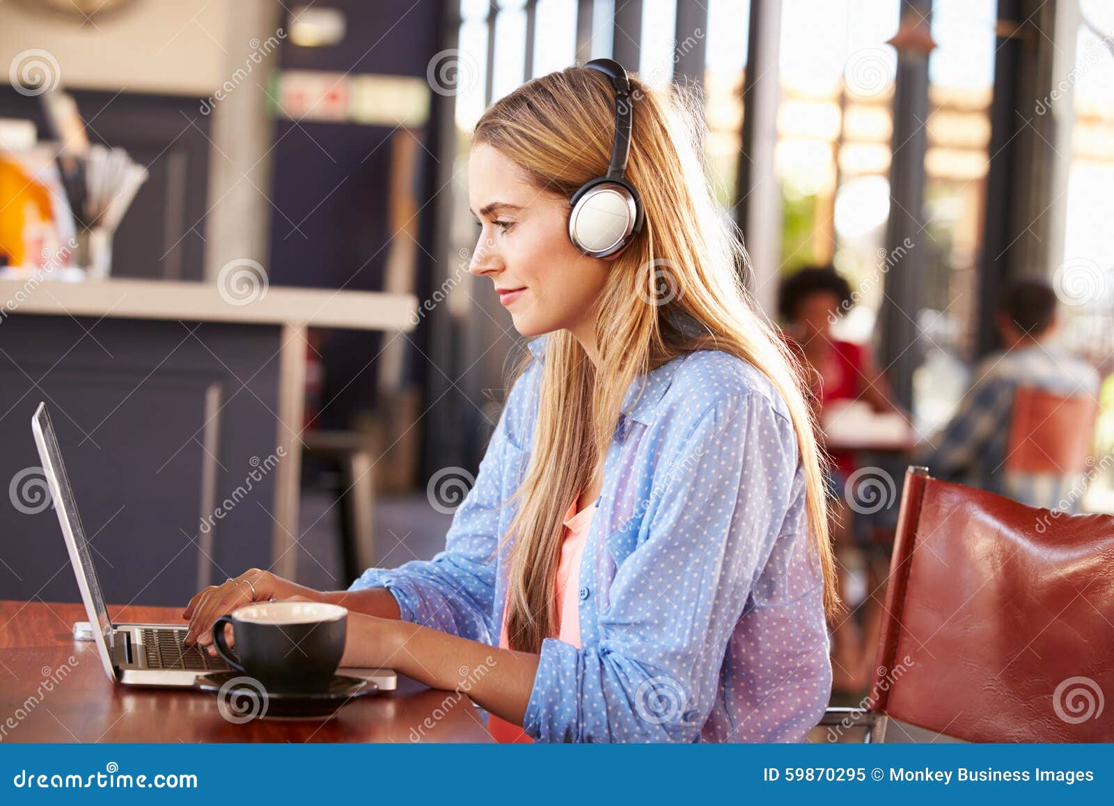 Young Woman Using Computer at a Coffee Shop Stock Image - Image of ...