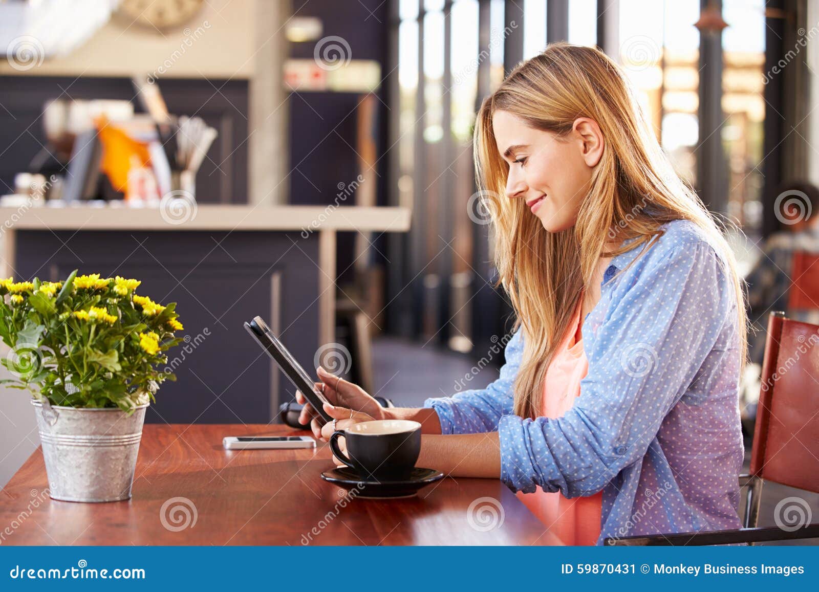 Young Woman Using Computer at a Coffee Shop Stock Image - Image of ...