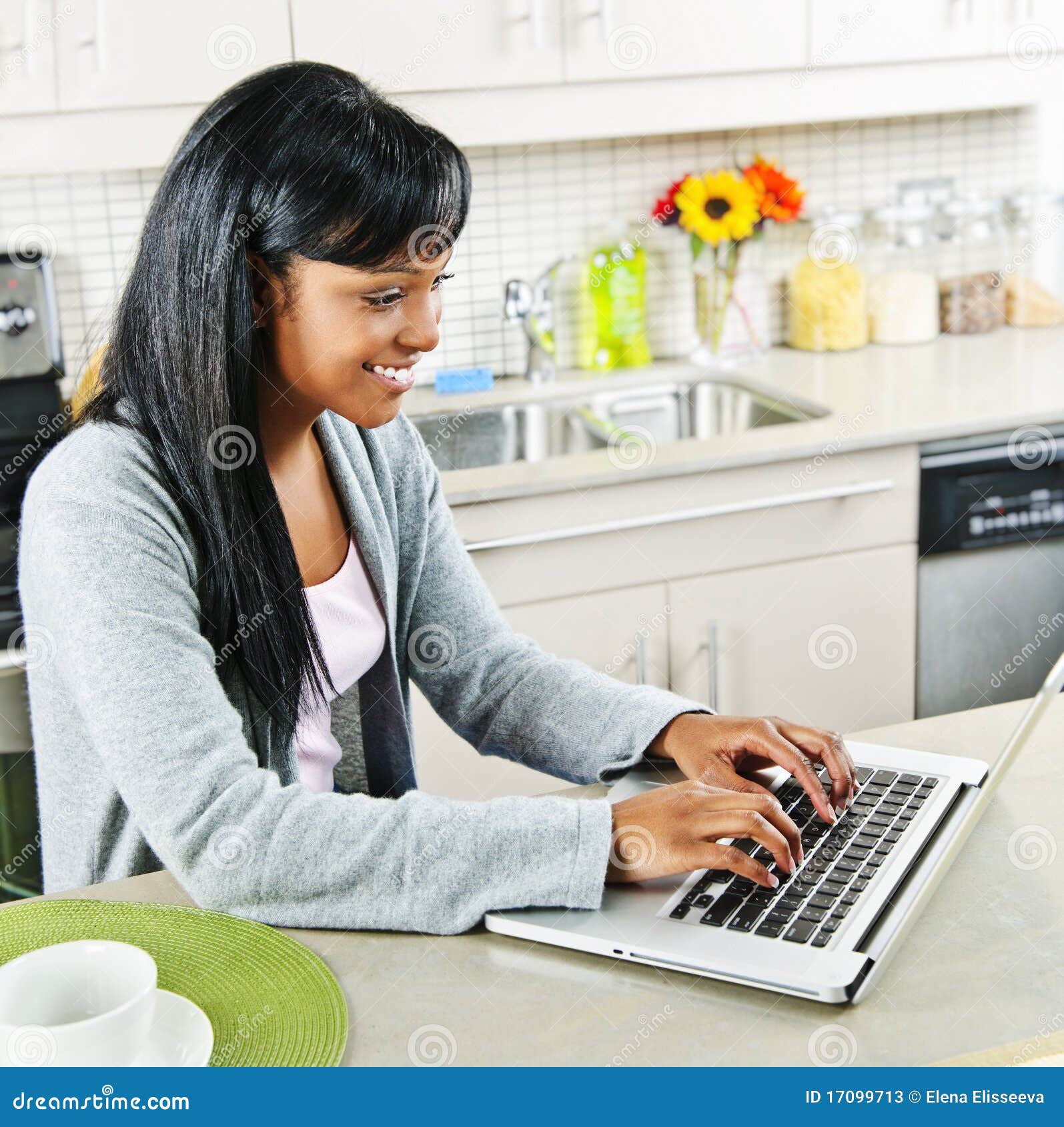 Young Woman Using Computer in Kitchen Stock Image - Image of house ...