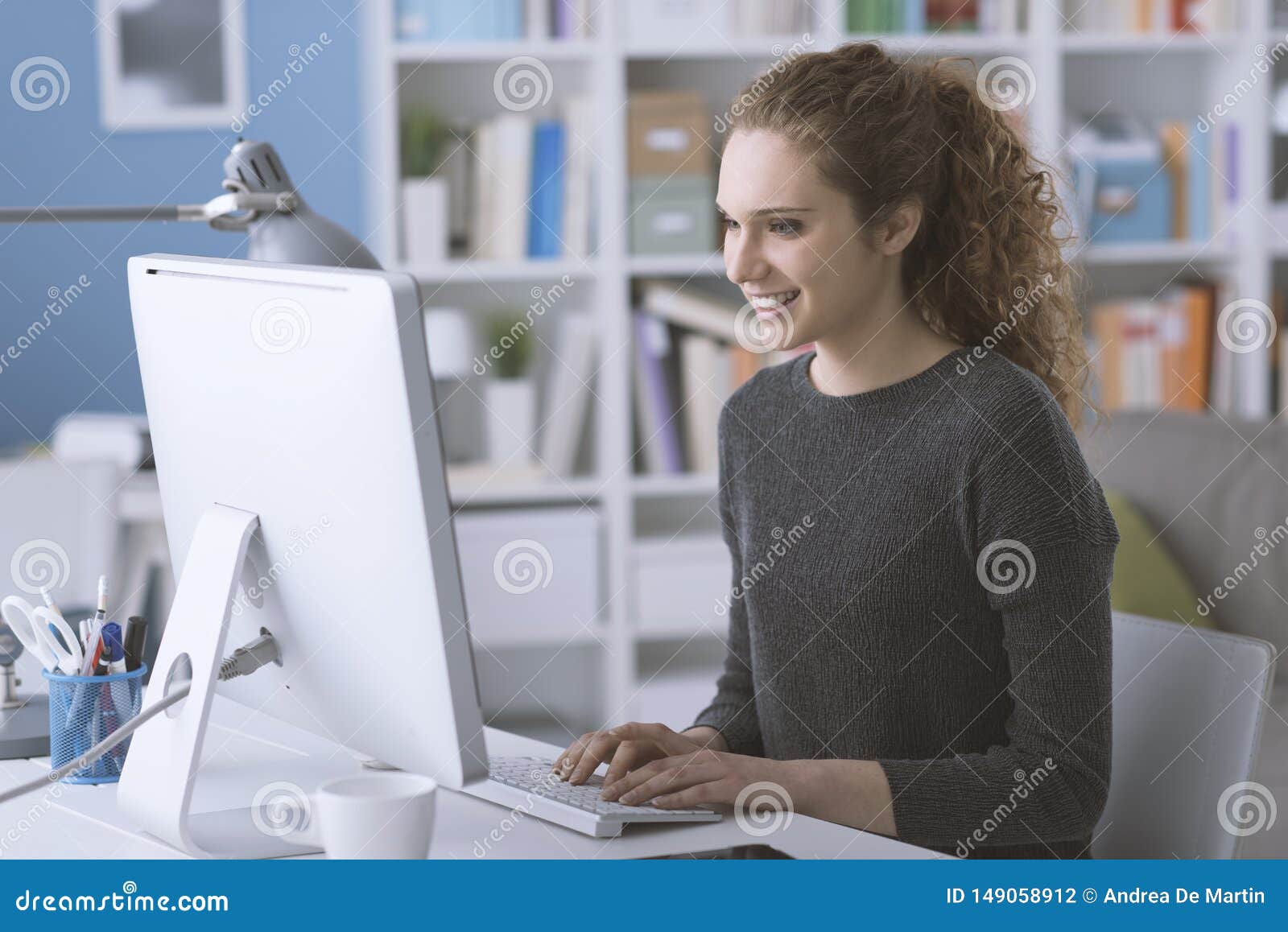 Young Woman Using a Computer in the Office Stock Photo - Image of ...