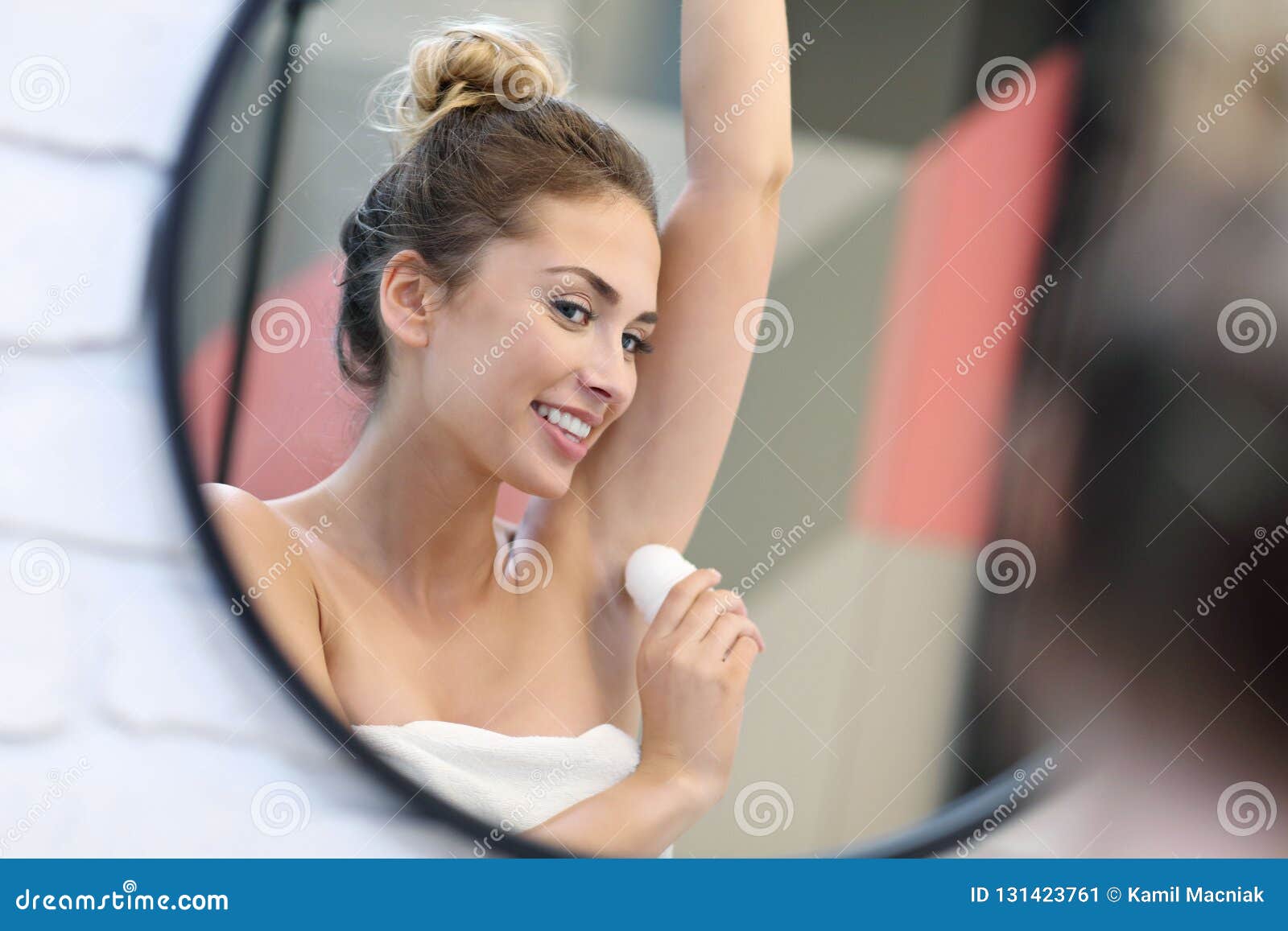 Young Woman Using Deodorant in Bathroom Stock Image - Image of hair ...