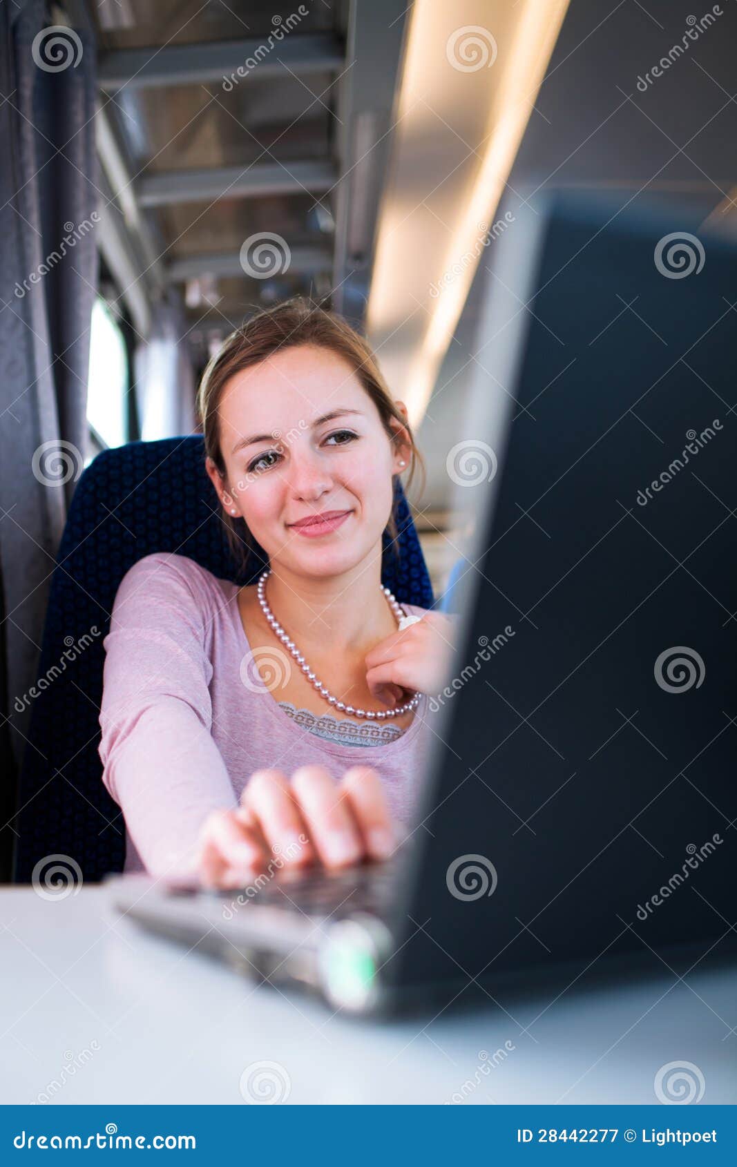 Young Woman Using Her Laptop Computer while on the Train Stock Image ...