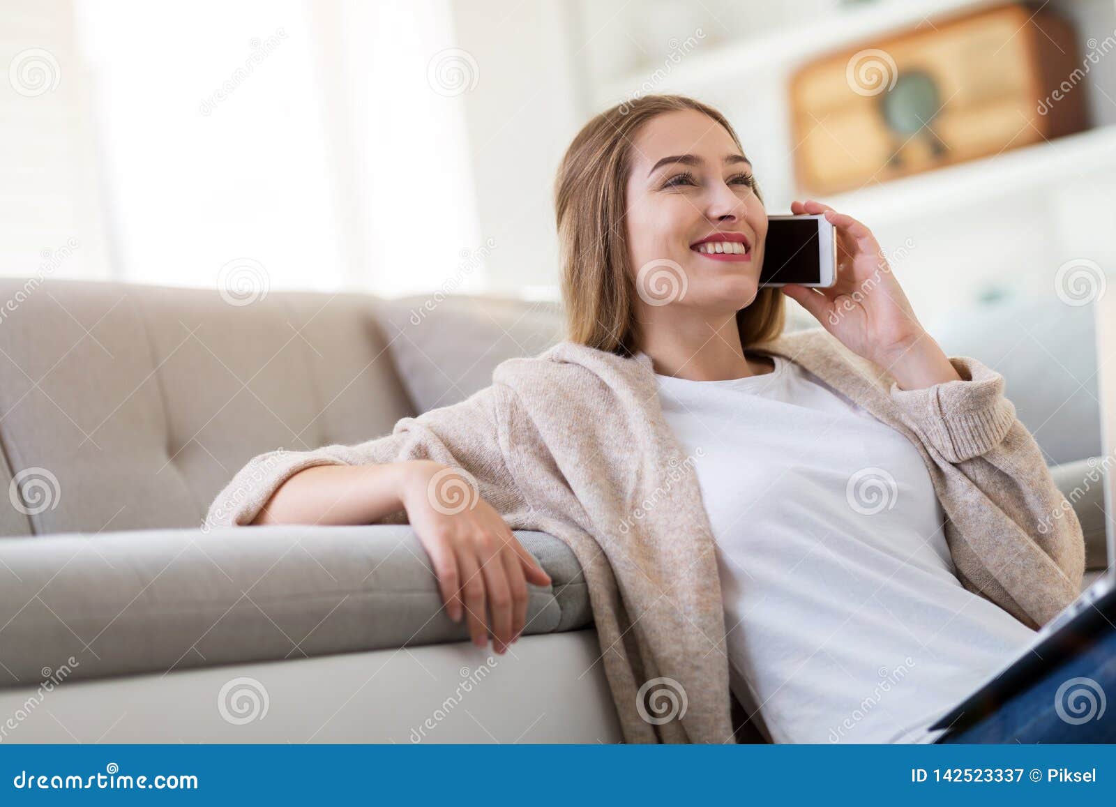 Young Woman Using Her Smartphone at Home Stock Image - Image of indoors ...