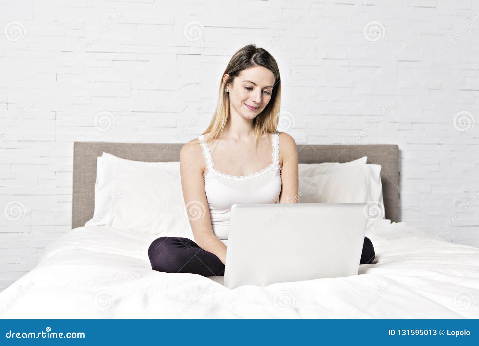 A Young Woman Using Laptop on Bed Stock Image - Image of lifestyles ...