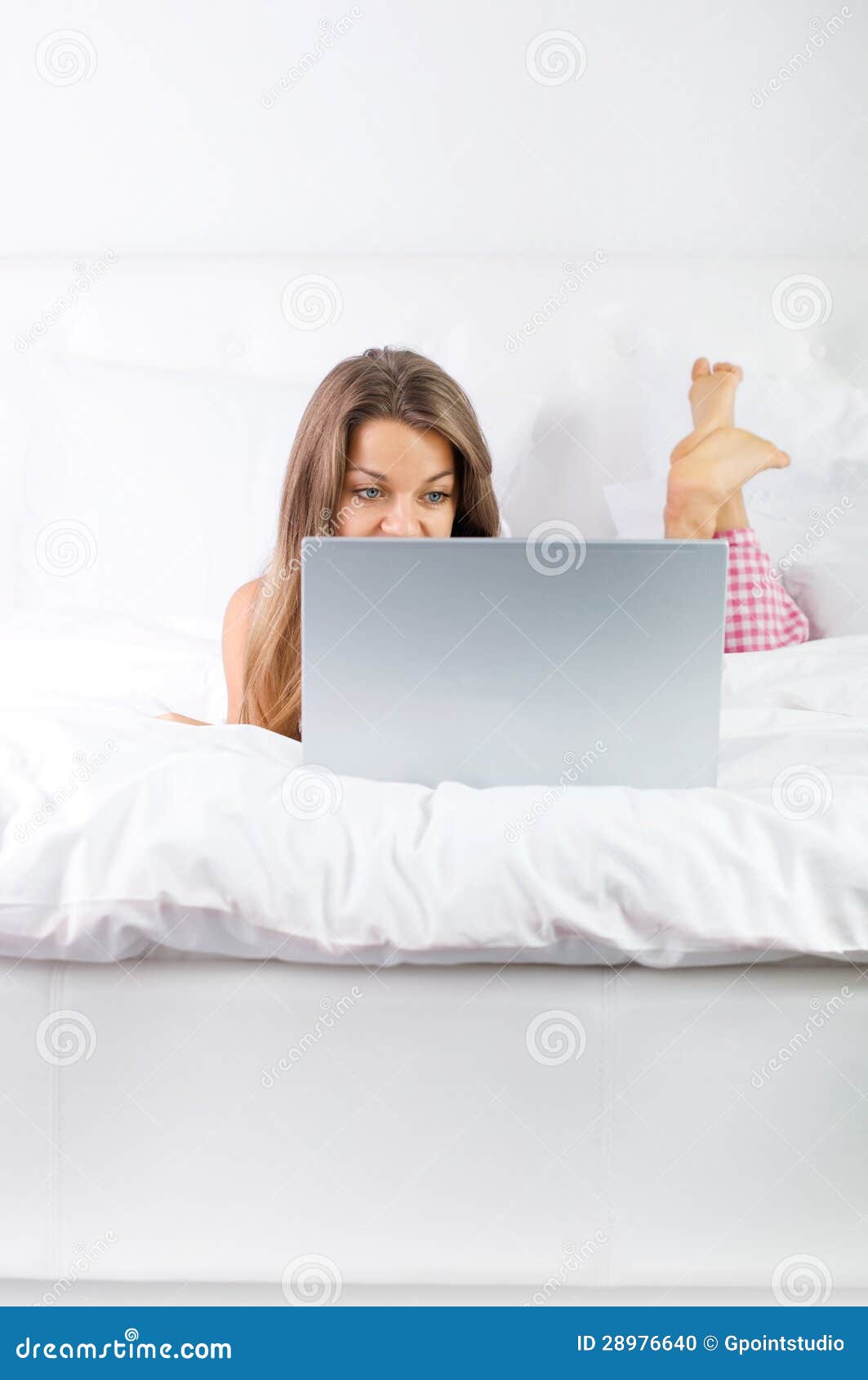 Young Woman Using Laptop in Bed Stock Photo - Image of individuality ...
