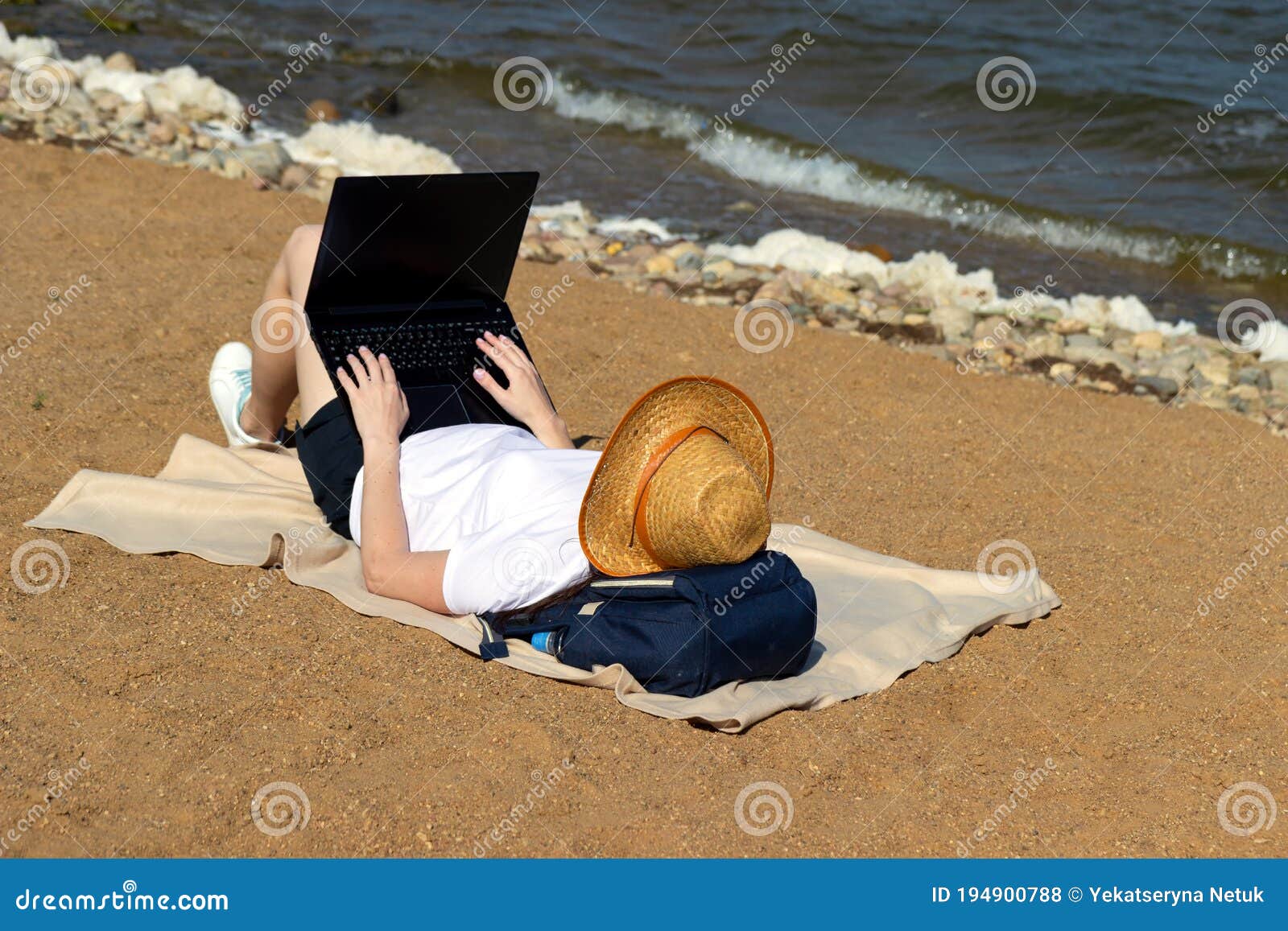 Young Woman Using Laptop Computer on a Beach. Freelance Work Concept ...