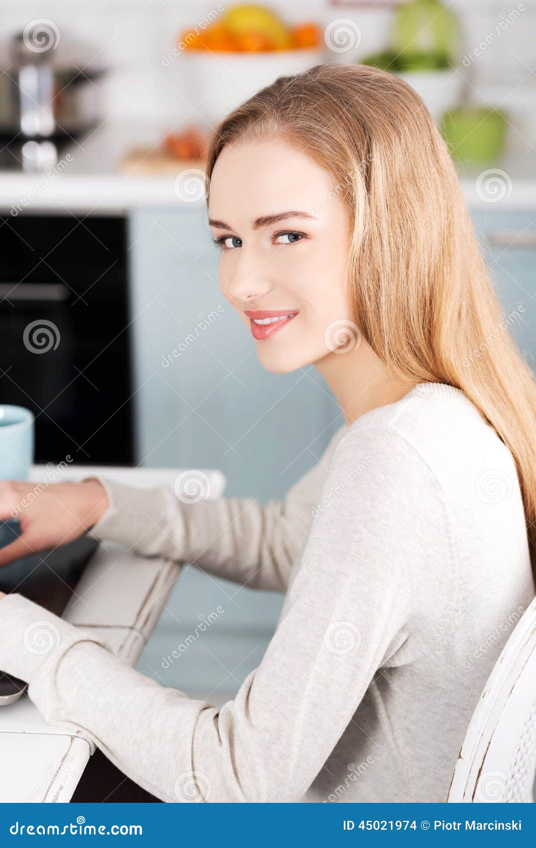 Young Woman Using a Laptop Computer at Home Stock Photo - Image of ...
