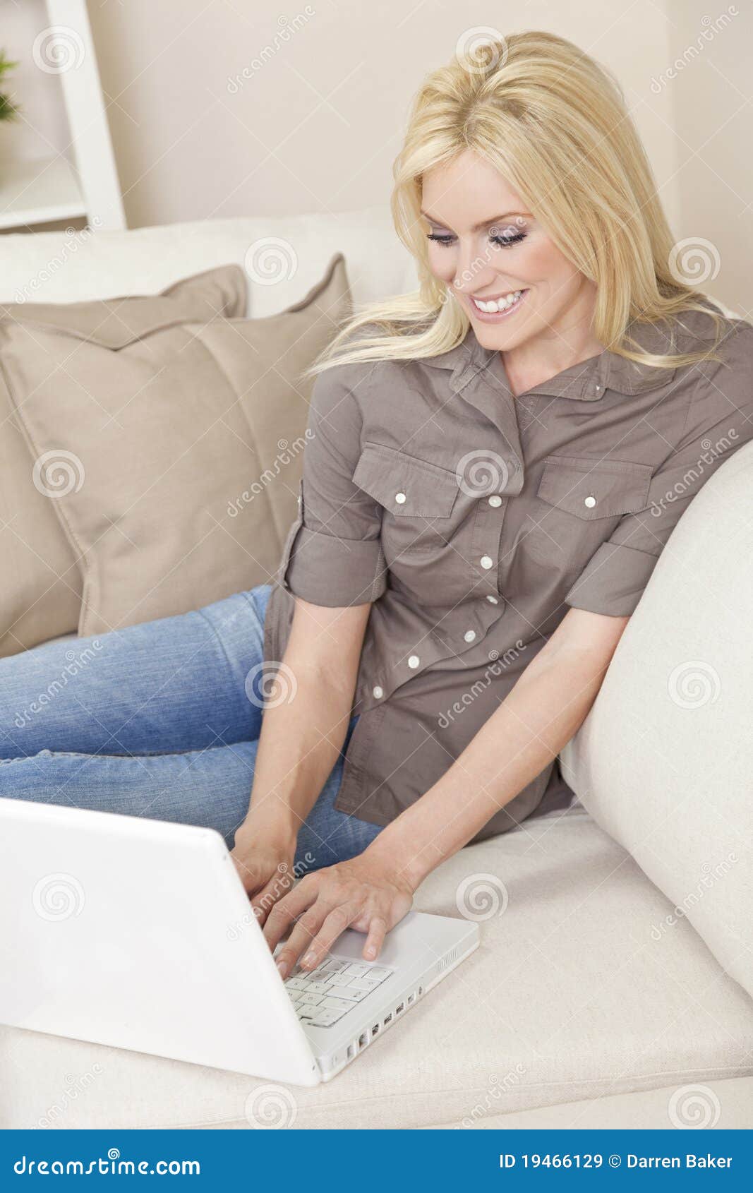 Young Woman Using Laptop Computer at Home on Sofa Stock Image - Image ...