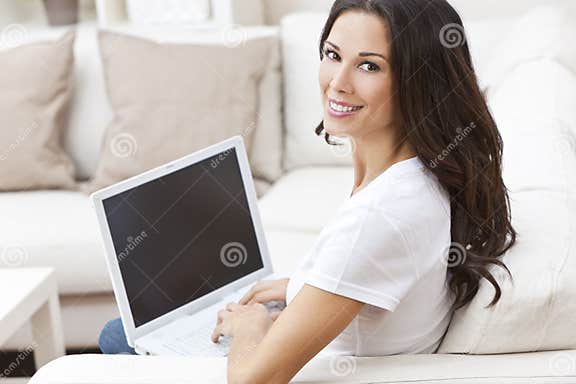 Young Woman Using Laptop Computer at Home on Sofa Stock Photo - Image ...