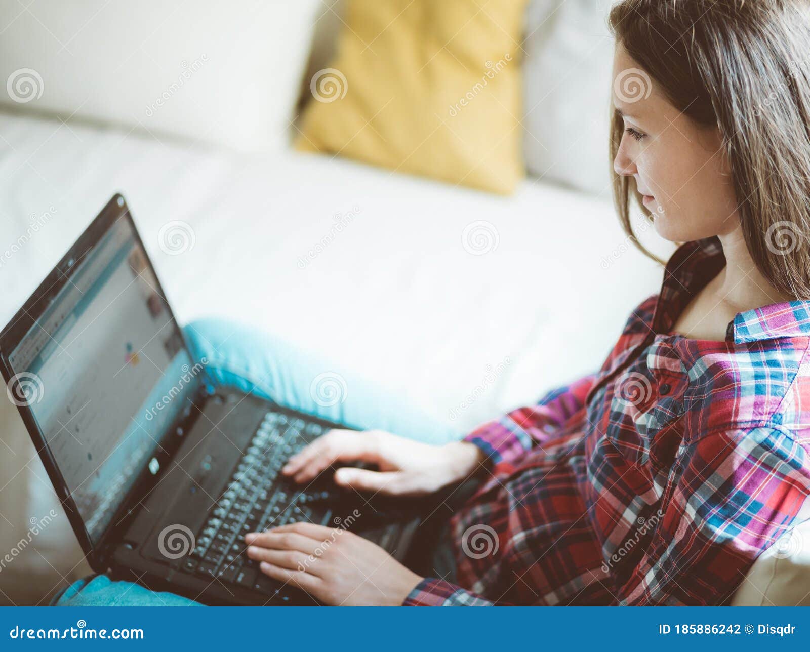 Young Woman Using Laptop Computer at Home. Working from Home. Stock ...