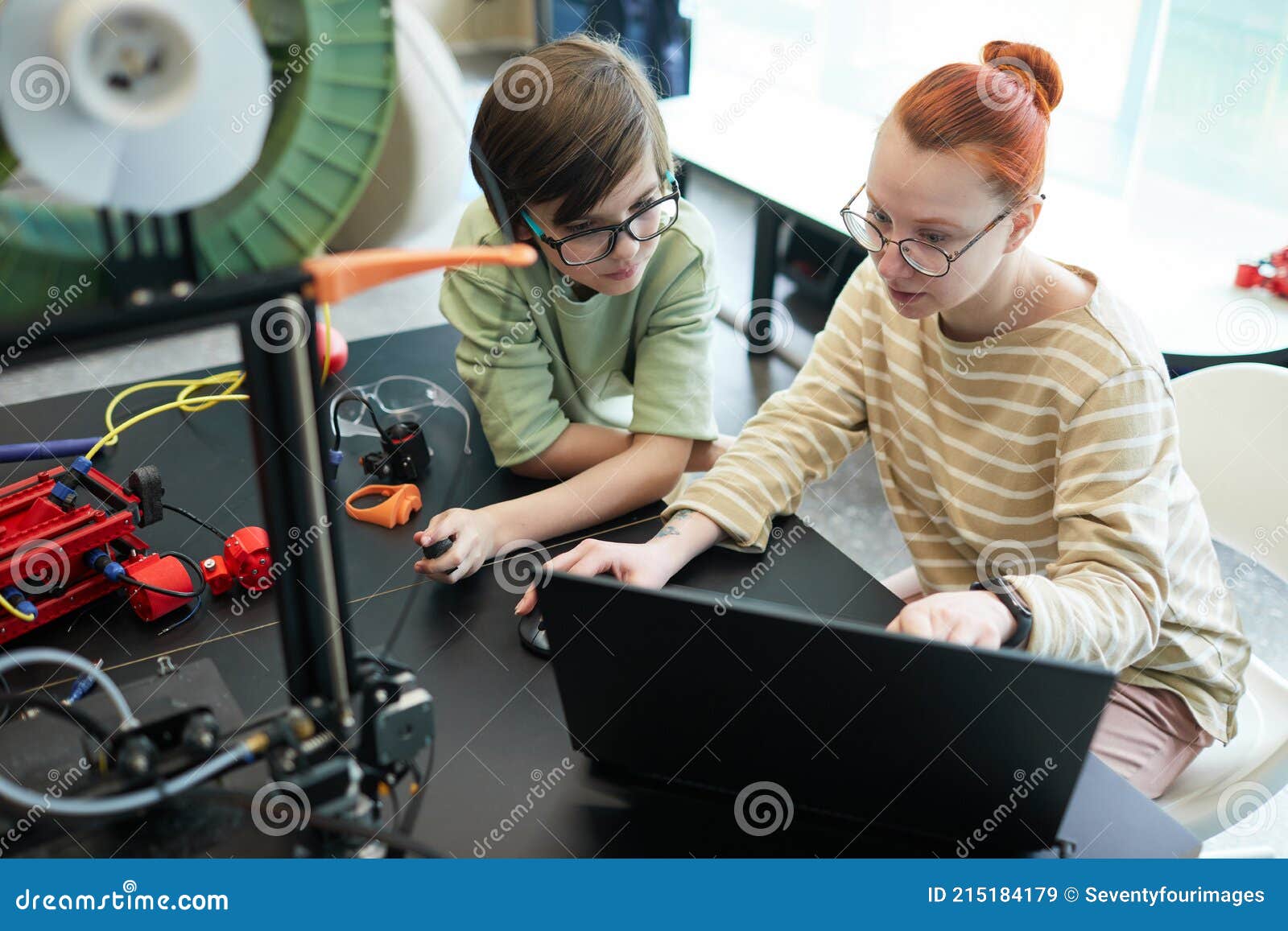 Young Woman Using Laptop in Engineering Class Stock Image - Image of ...