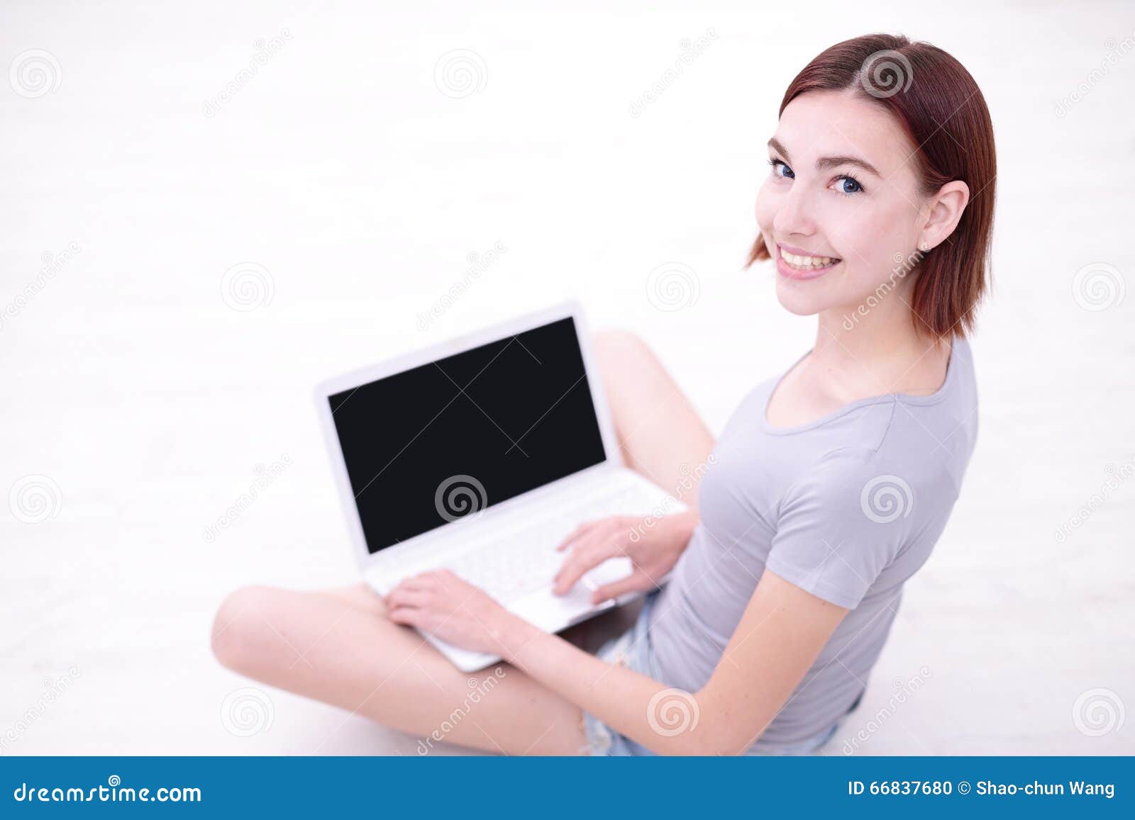 Young woman using laptop stock photo. Image of display - 66837680