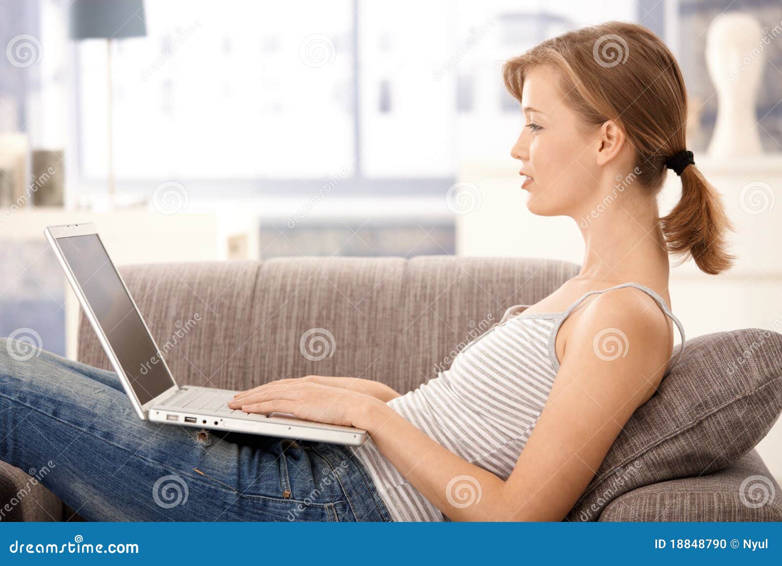 Young Woman Using Laptop at Home Stock Photo - Image of indoors, adult ...