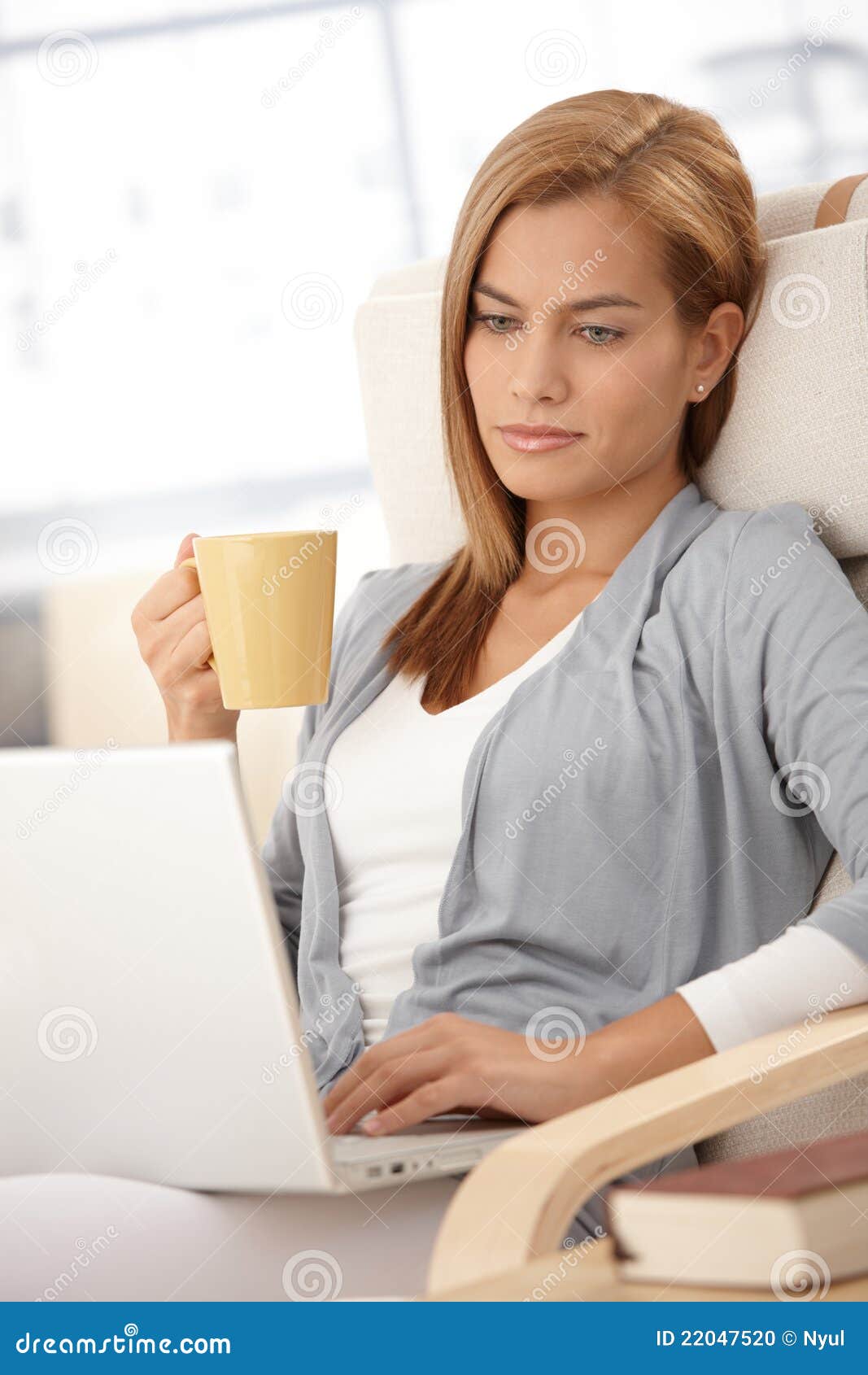 Young Woman Using Laptop at Home Stock Photo - Image of blond, blonde ...
