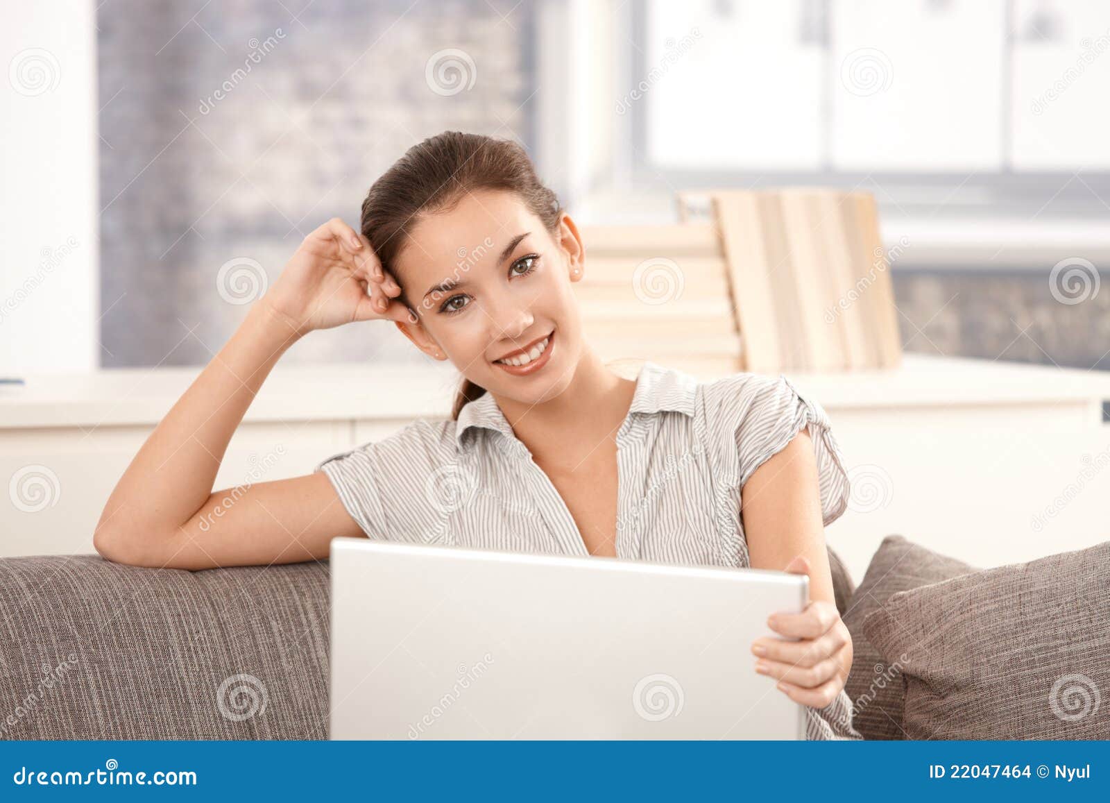 Young Woman Using Laptop at Home Smiling Stock Photo - Image of ...