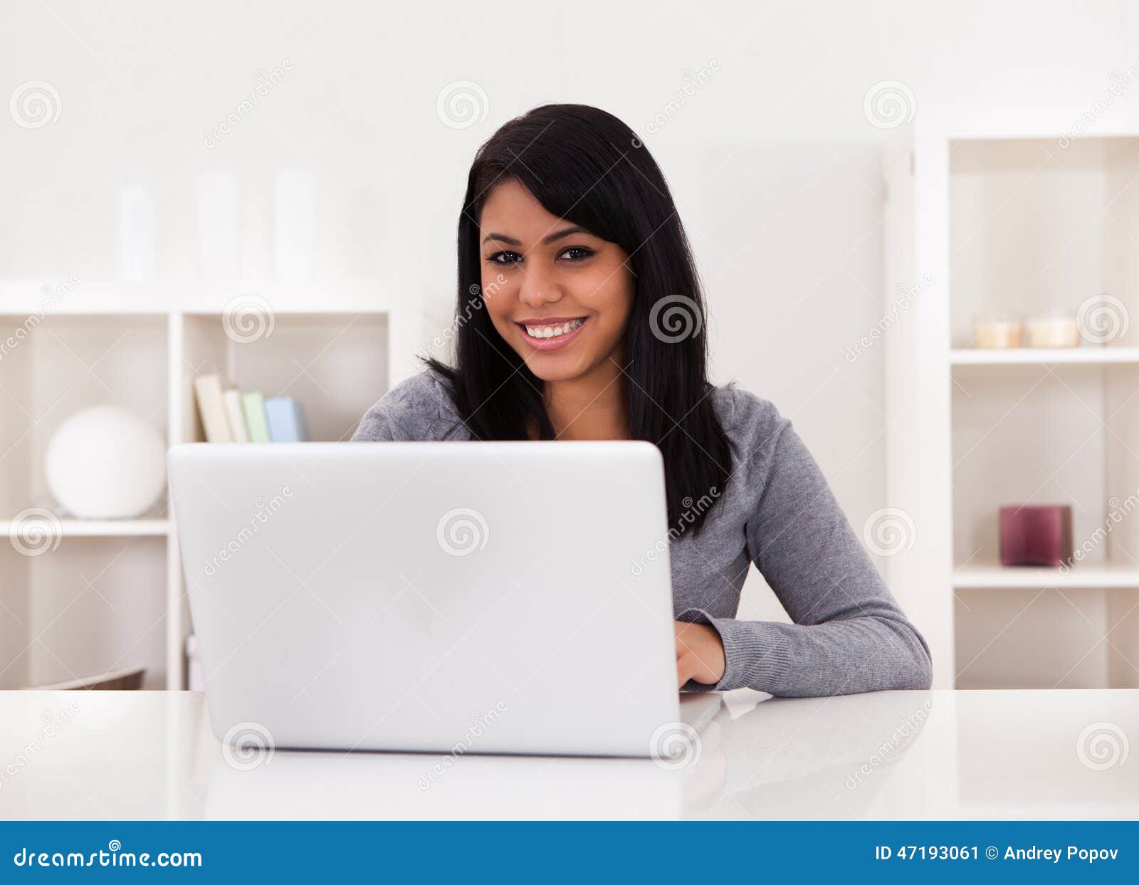 Young woman using laptop stock image. Image of female - 47193061