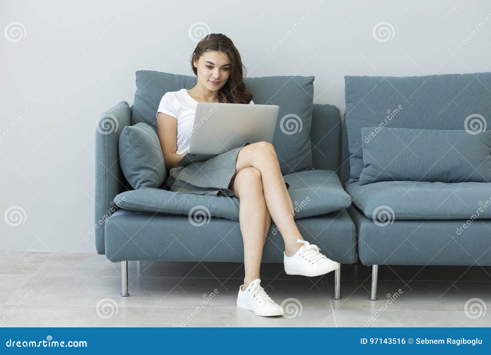 Young Woman Using Laptop on Sofa Stock Photo - Image of youth, student ...