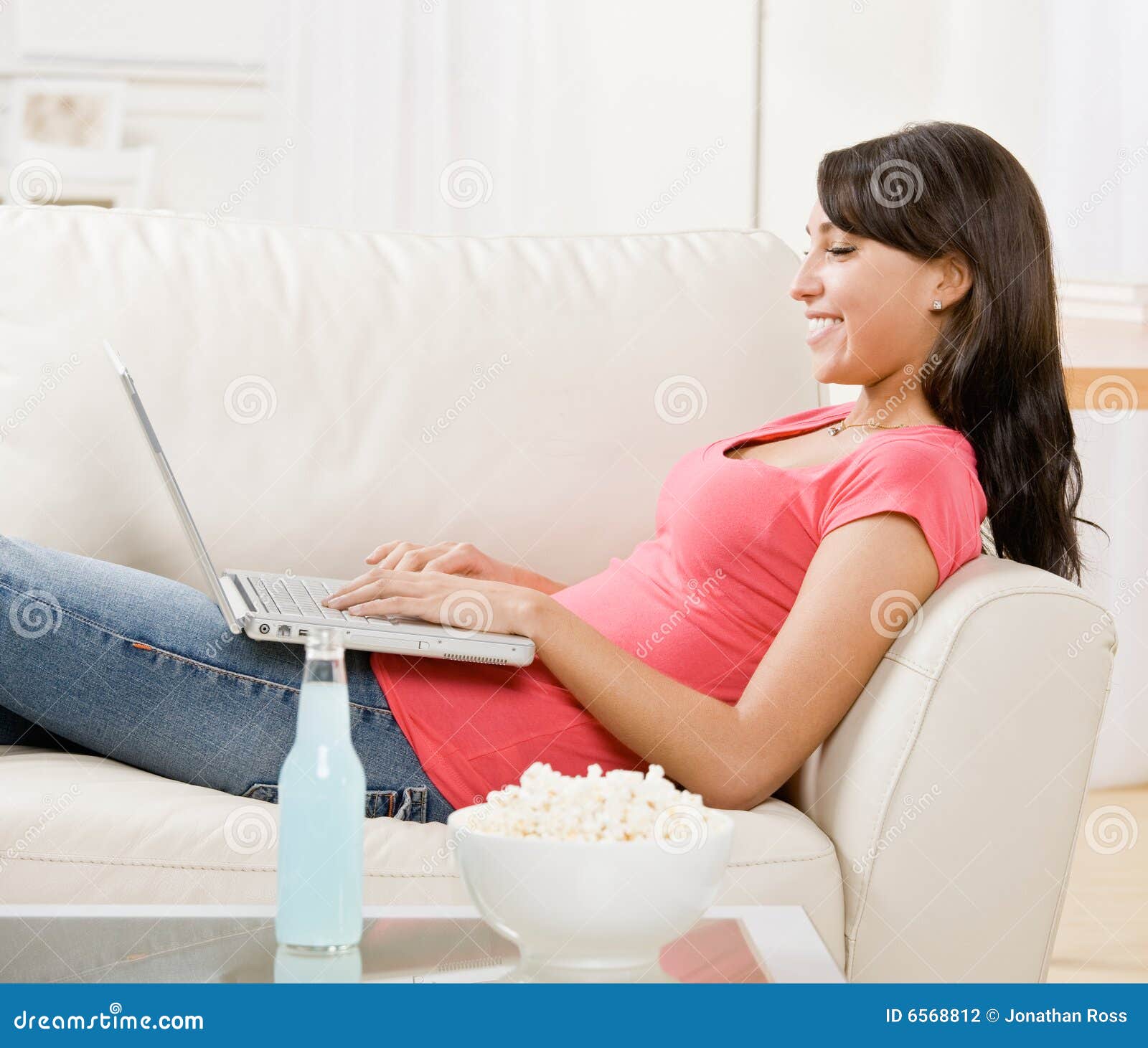 Young Woman Using Laptop on Sofa at Home Stock Photo - Image of ...