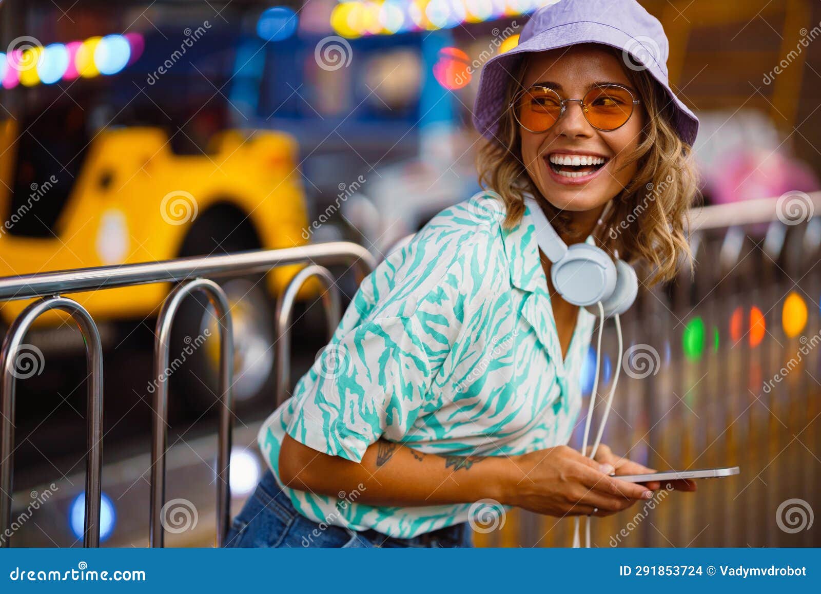 Young Woman Using Mobile Phone while Spending Time in Attraction Park ...