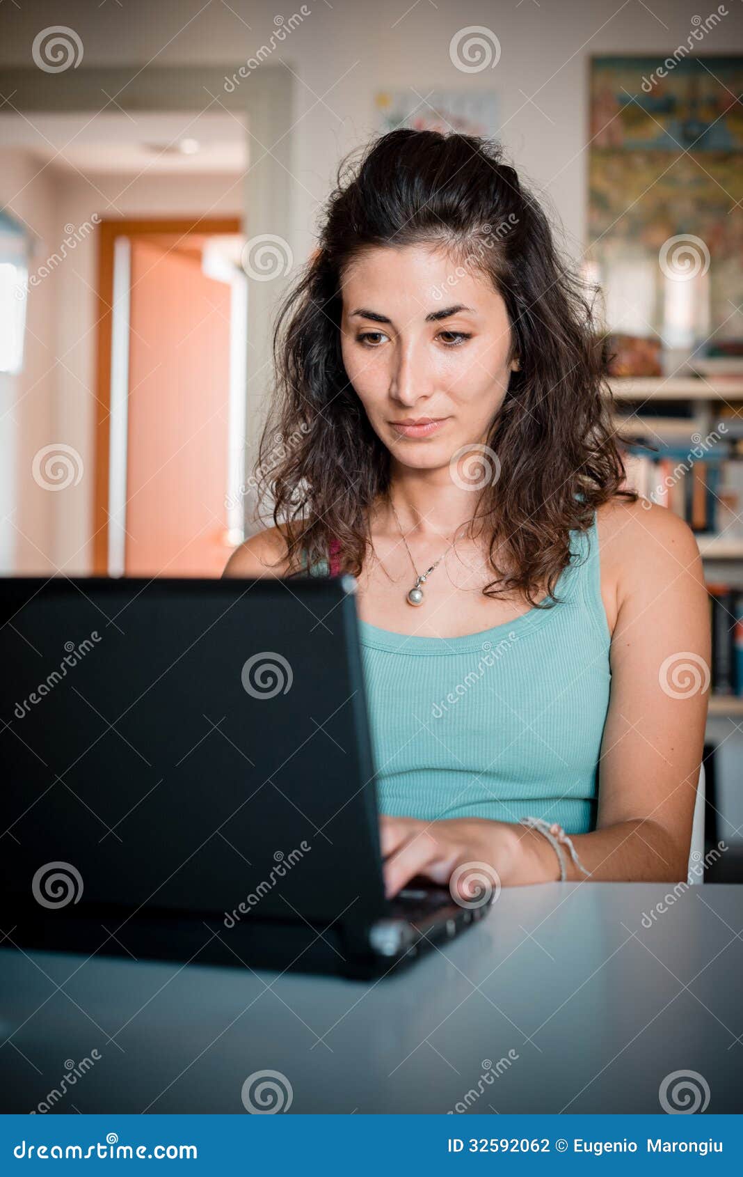 Young woman using notebook stock photo. Image of home - 32592062