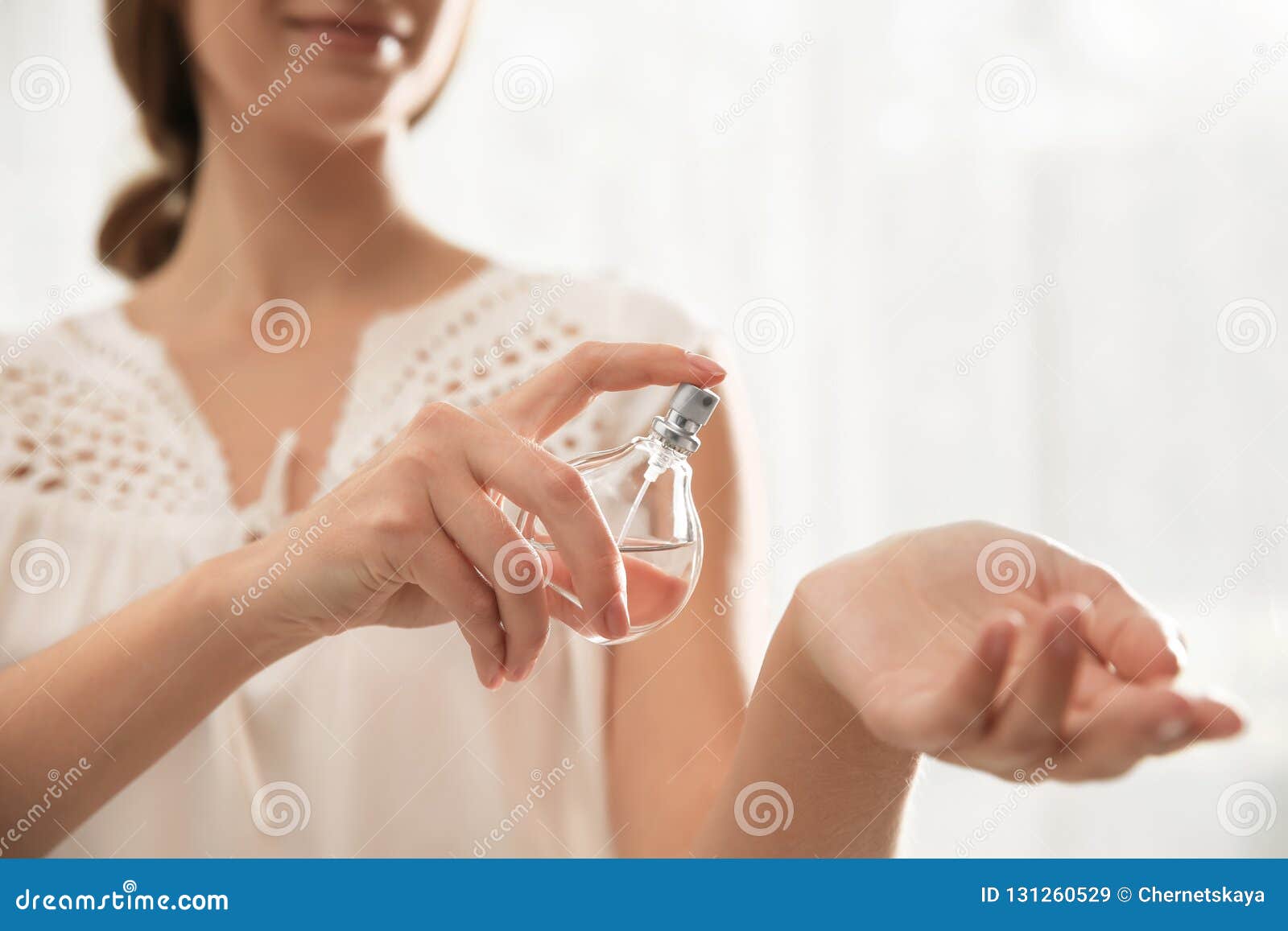 Young Woman Using Perfume Indoors Stock Image - Image of fragrance ...