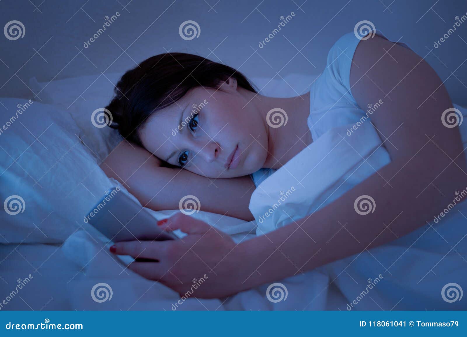 Young Woman Using Phone Lying in Bed Stock Image - Image of application ...