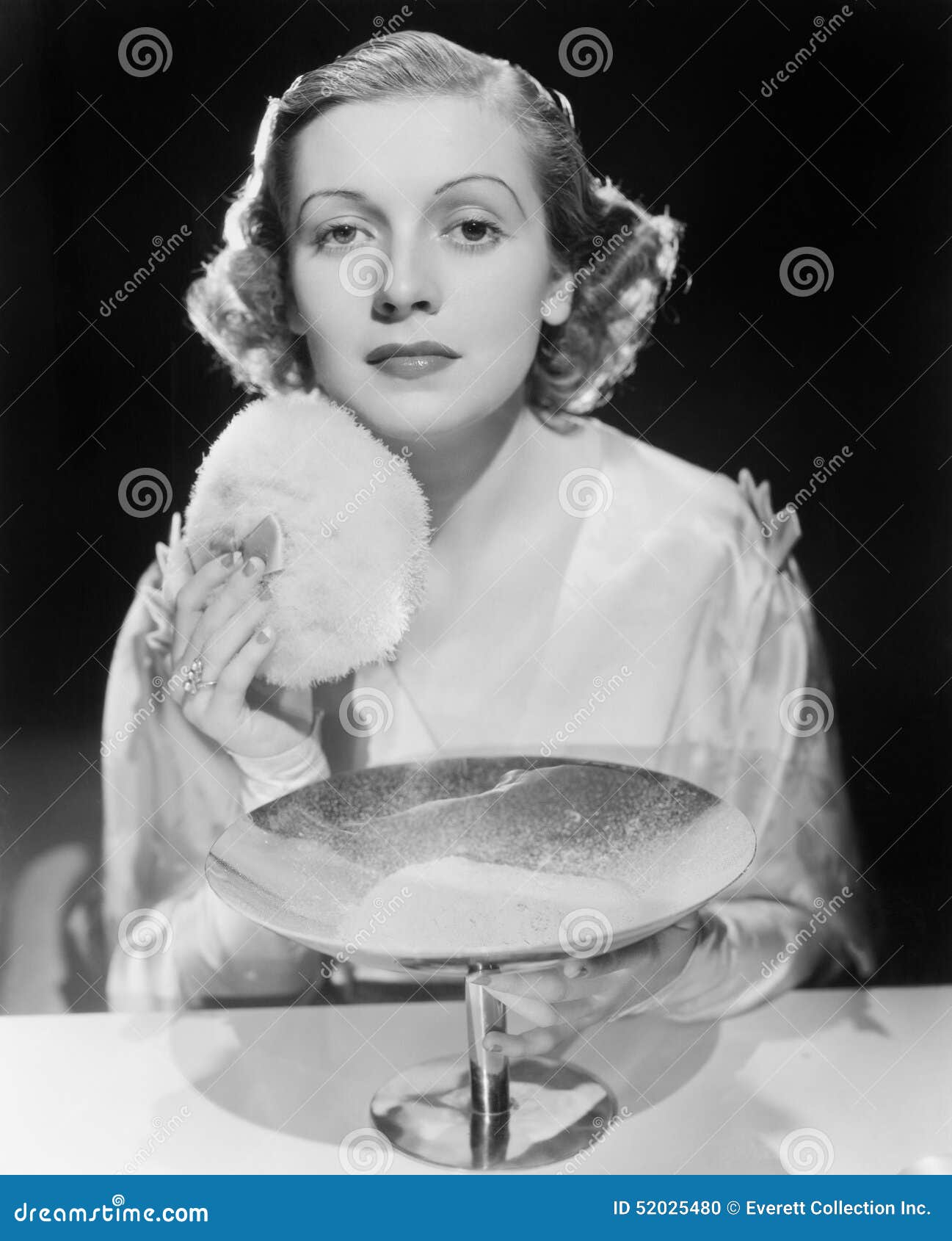 Young Woman Using a Powder Puff Stock Photo - Image of females, head ...