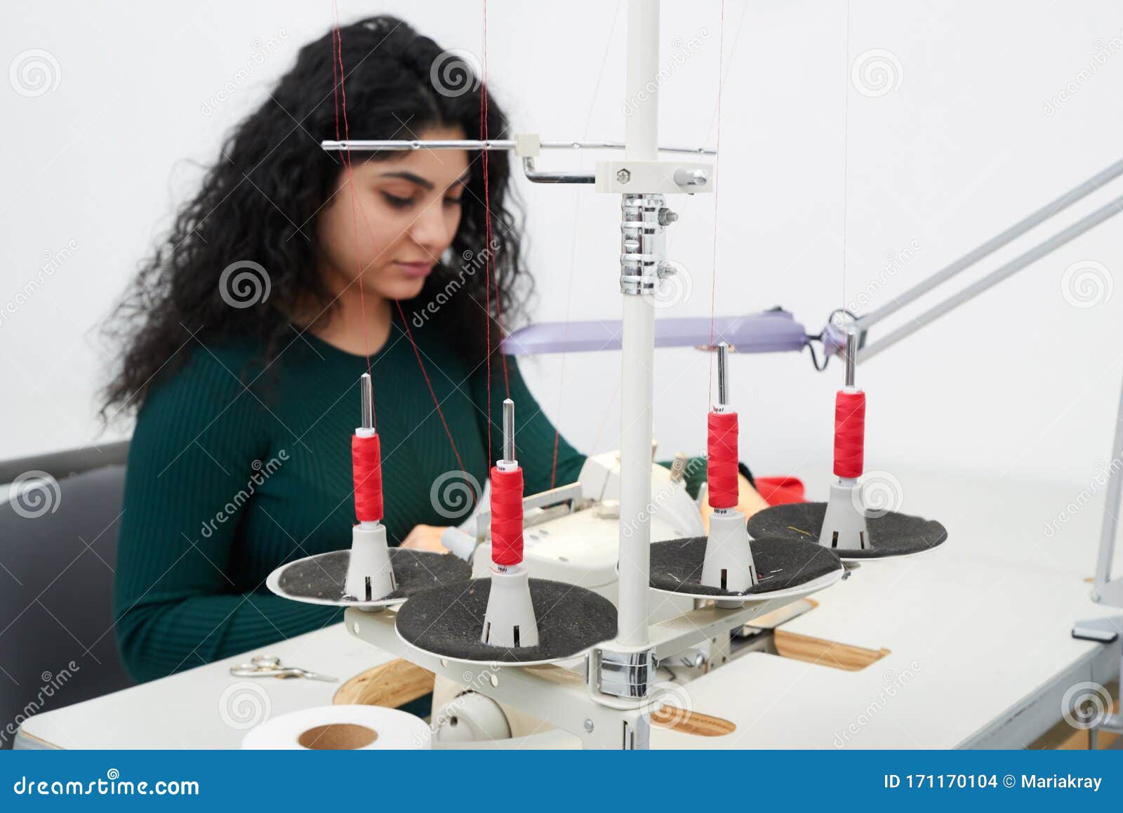 Young Woman Using Professional Overlock Sewing Machine in Workshop ...