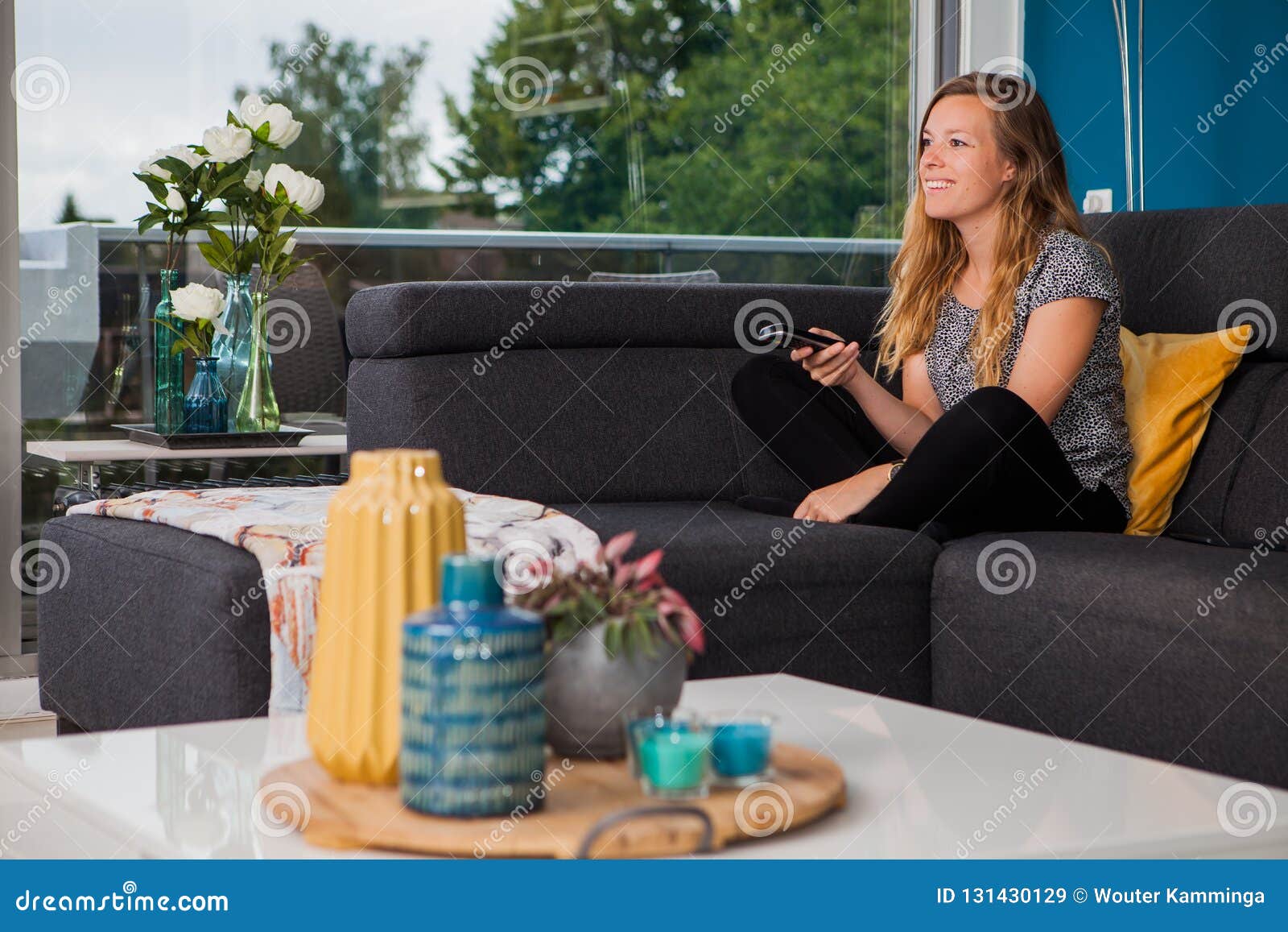 Young Woman Using a Remote Control on the Couch Stock Image - Image of ... Young Woman Using a Remote Control on the Couch Stock Image - Image of ...