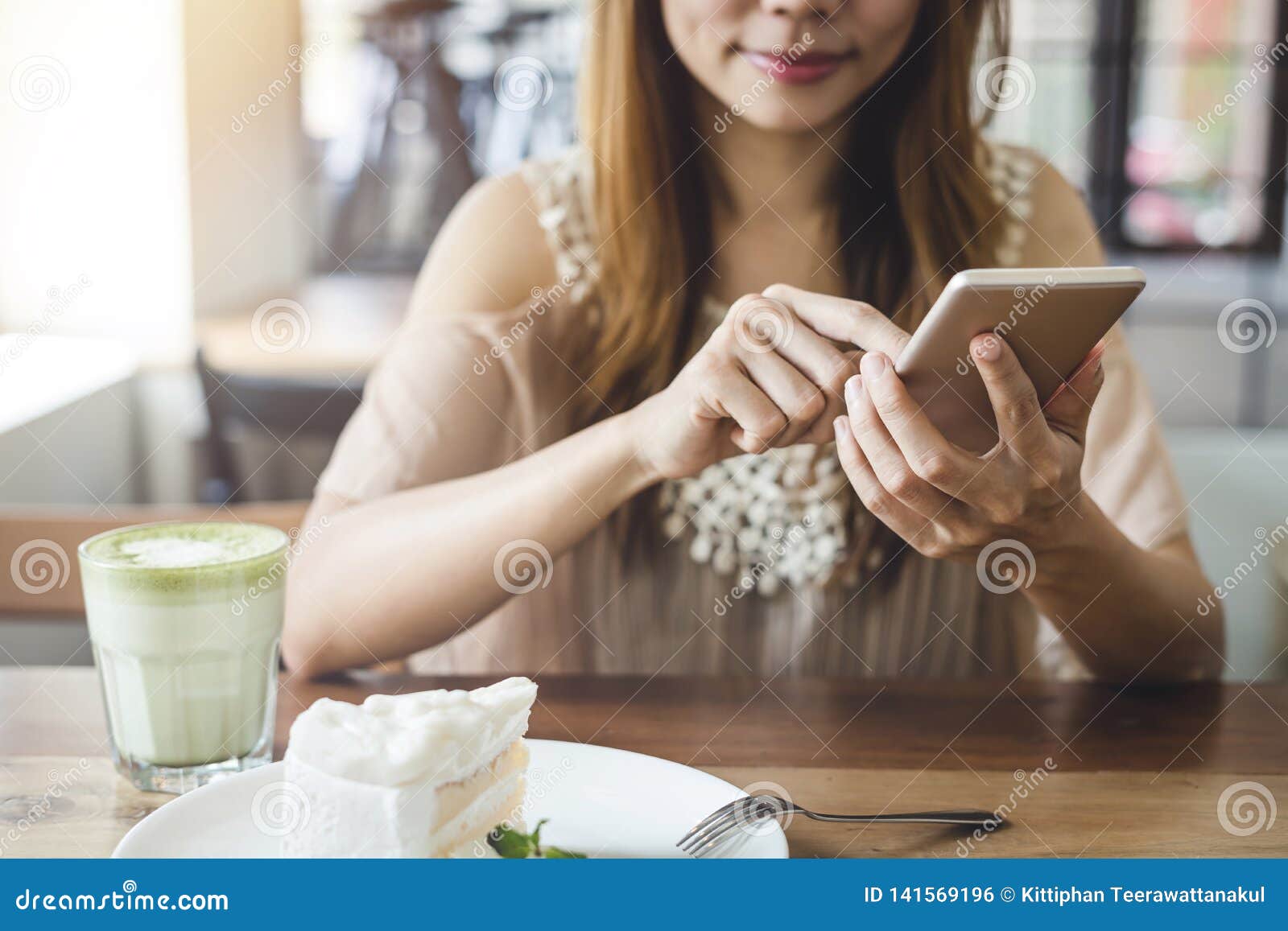 Young Woman Using Smart Phone and Eating Cake Stock Photo - Image of ...