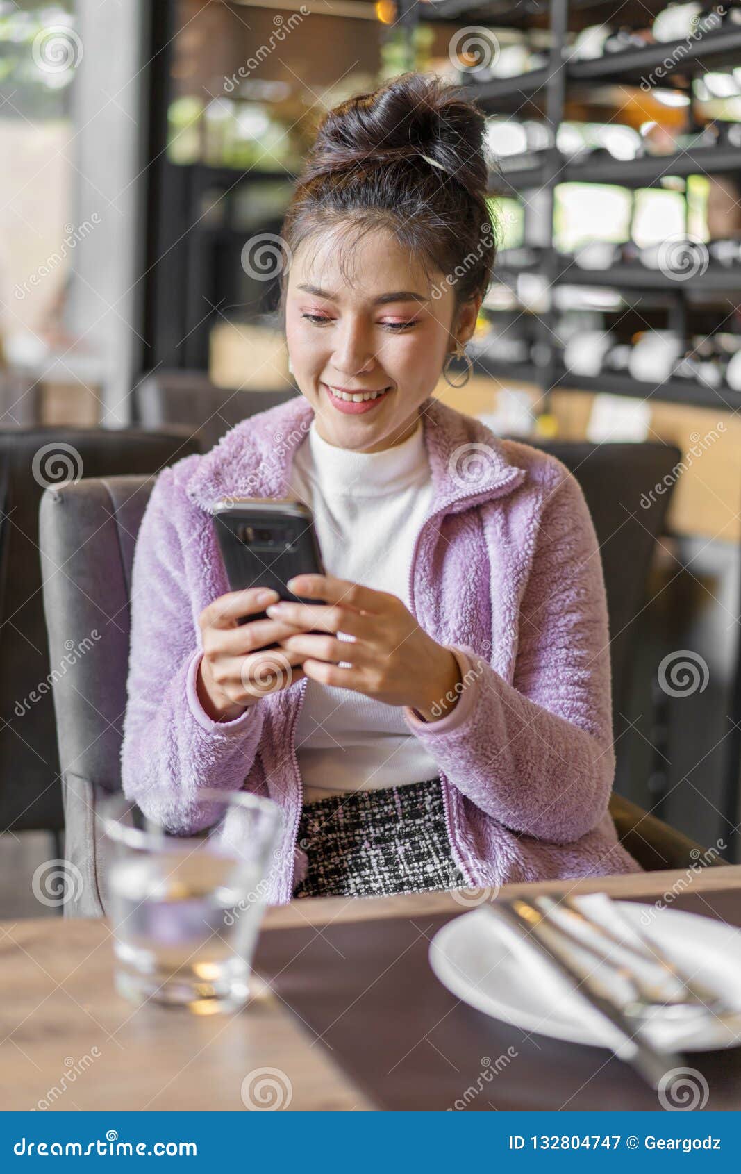 Woman Using Smartphone in Restaurant Stock Image - Image of portrait ...