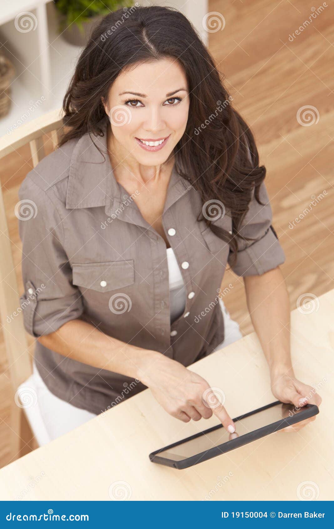 Young Woman Using Tablet Computer at Home Stock Photo - Image of ...