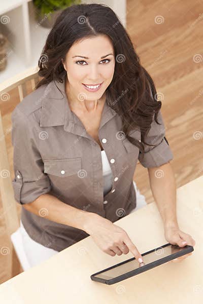 Young Woman Using Tablet Computer at Home Stock Photo - Image of ...