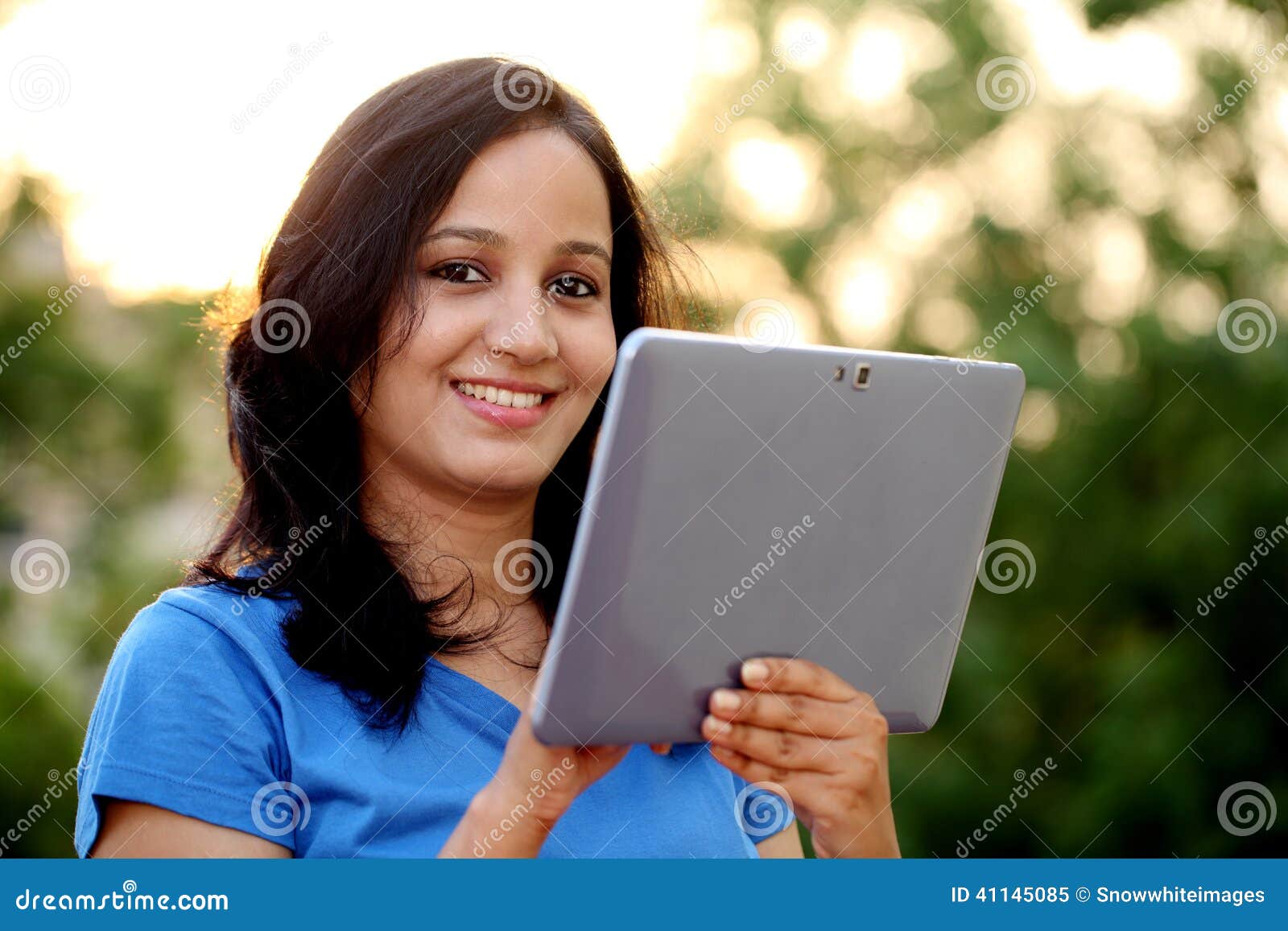 Young Woman Using Tablet Computer at Outdoor Stock Image - Image of ...