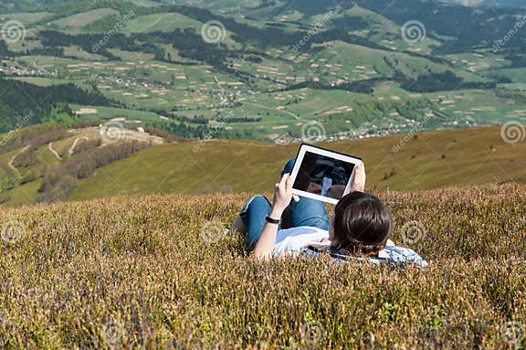 Young Woman Using Tablet Computer Outdoors Stock Photo - Image of ebook ...