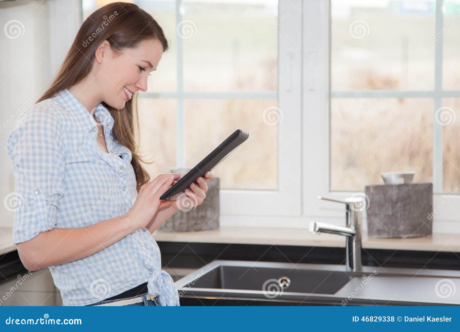 Young Woman Using Tablet Device Stock Photo - Image of european, device ... Young Woman Using Tablet Device Stock Photo - Image of european, device ...